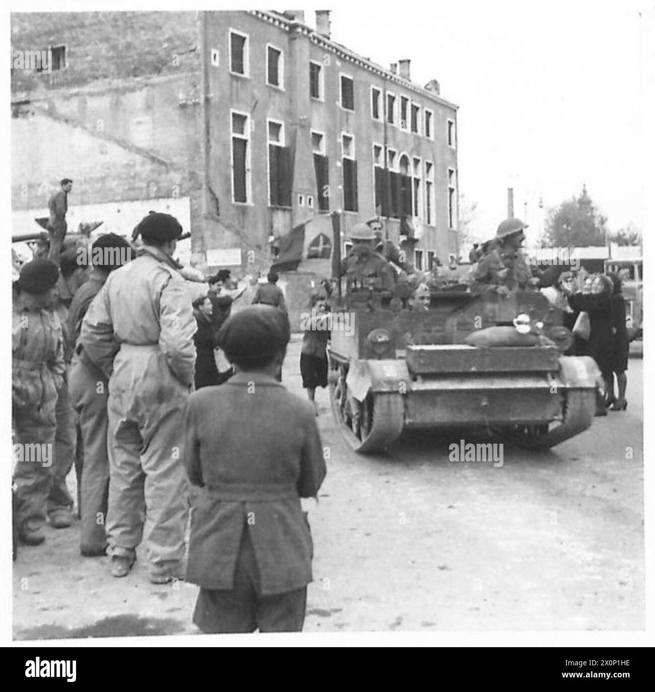 EIGHTH ARMY ENTER VENICE - A crowd of Venetians clap and cheer as ...