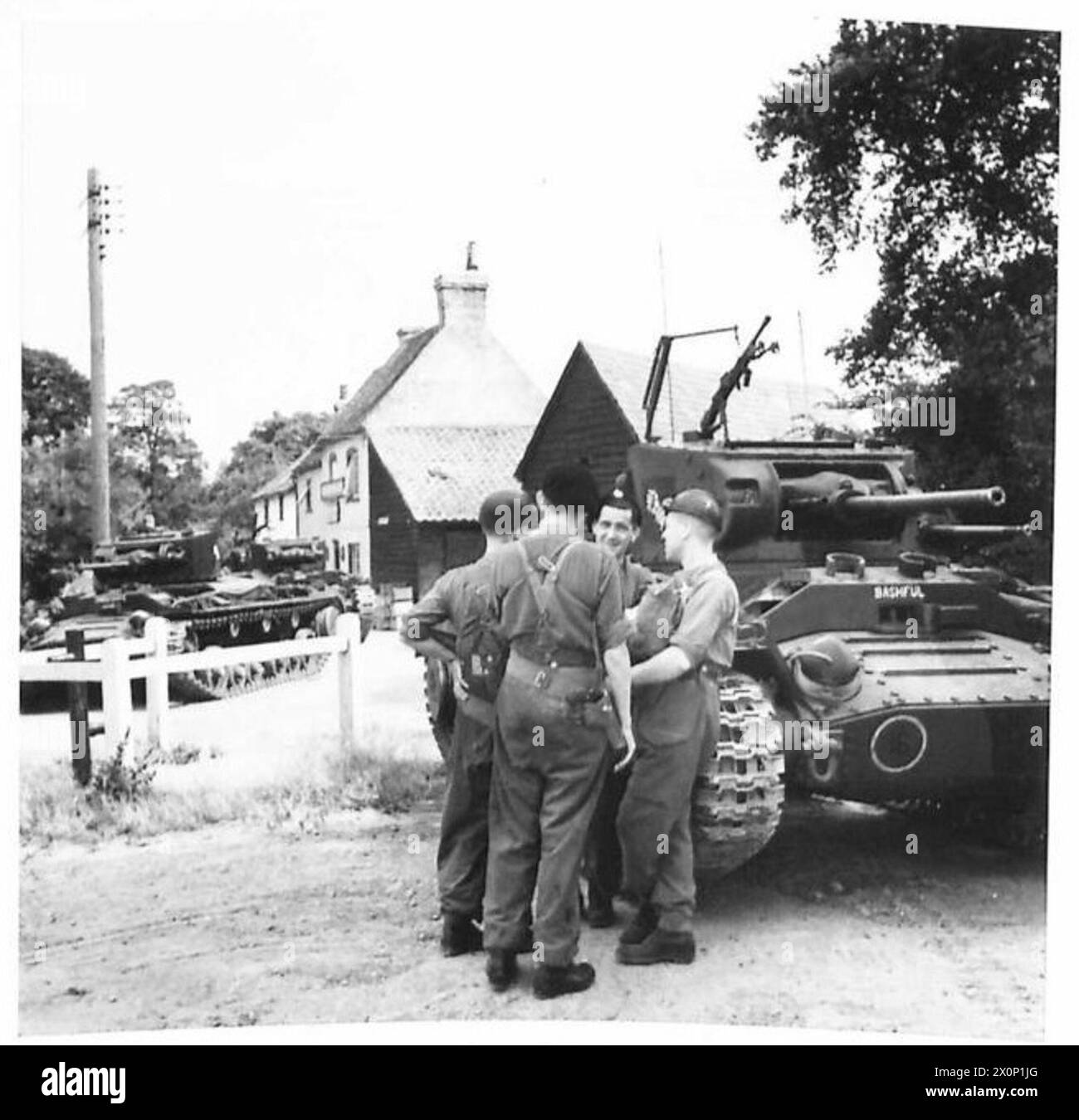 VALENTINE TANKS IN ACTION - The members of one of the Mk. Ill Valentine ...