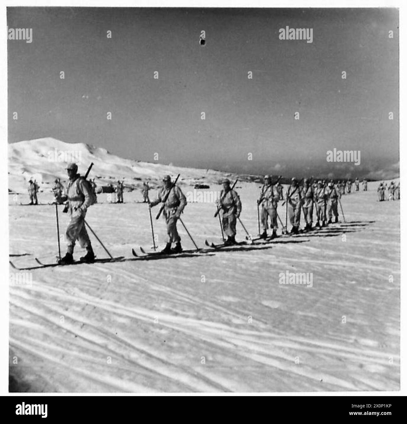 Ski troops in formation moving off in line during training exercises ...