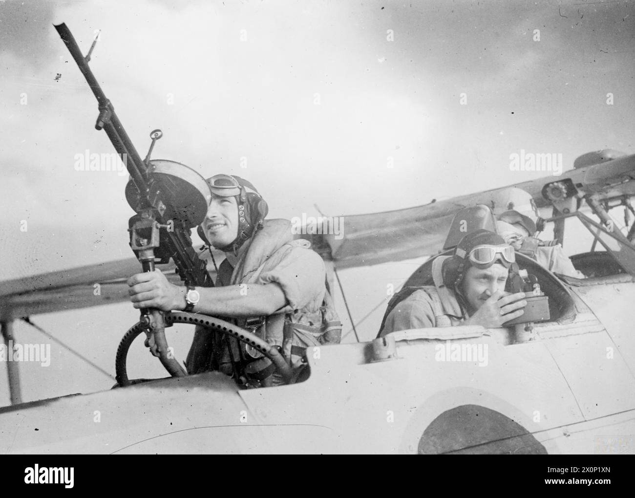 The Fairey Swordfish crew aboard HMS Battler check flight instruments ...