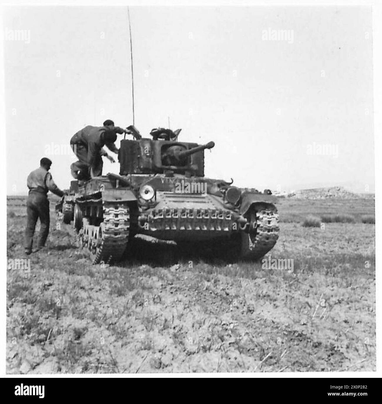 French tank corps personnel climb aboard Valentine tanks during ...
