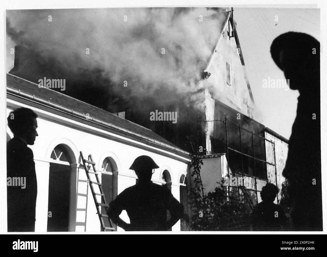 A house near the River Seine is set on fire by shelling during Allied ...
