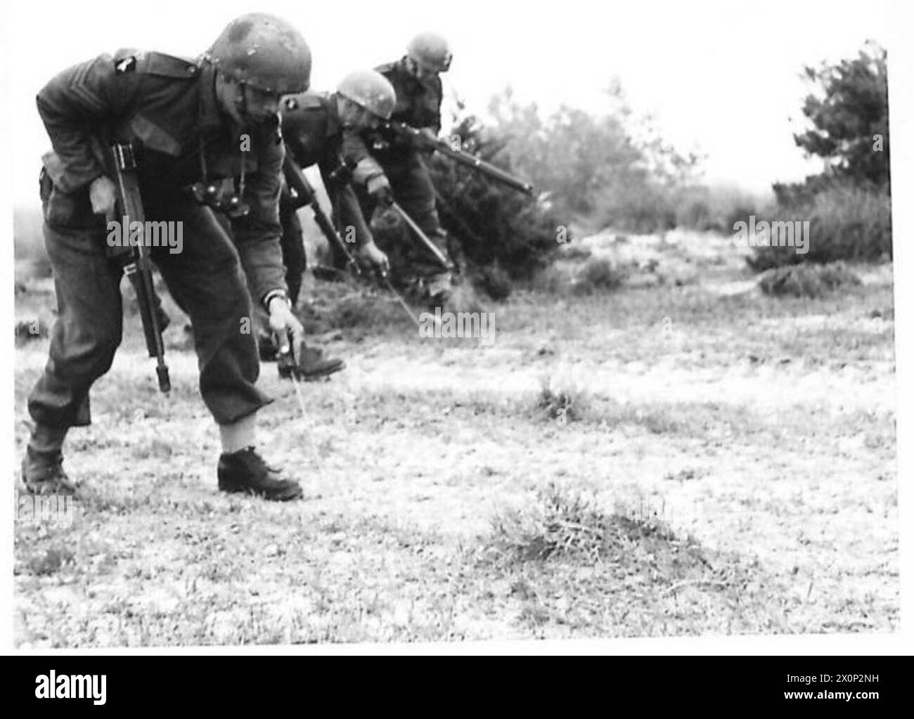RECCE. UNIT EXERCISE - Recce infantry creep forward under cover of a ...