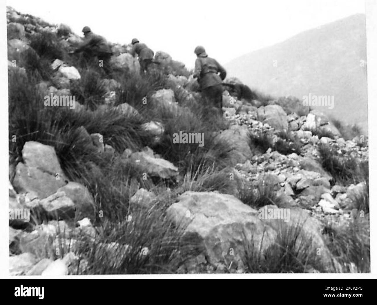 Italian infantry advance up the rocky slopes of Mt. Lungo as part of ...
