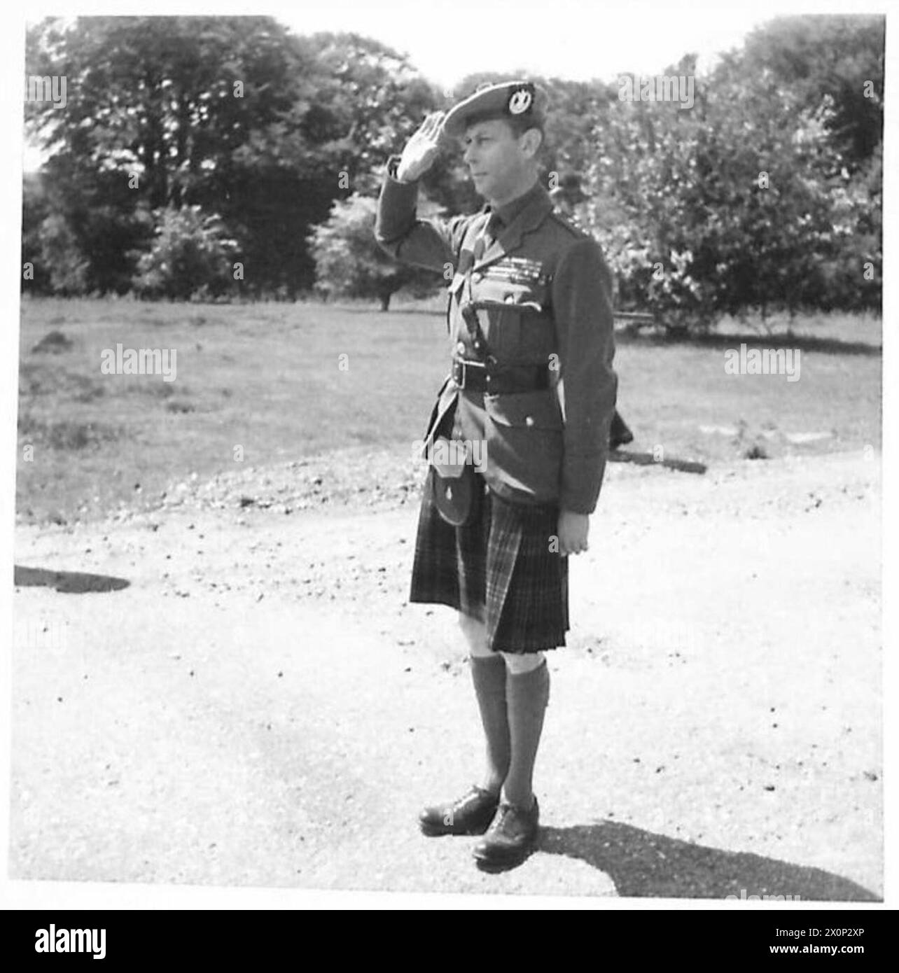 KING AND QUEEN VISIT TROOPS - The King wearing Highland uniform as Col ...
