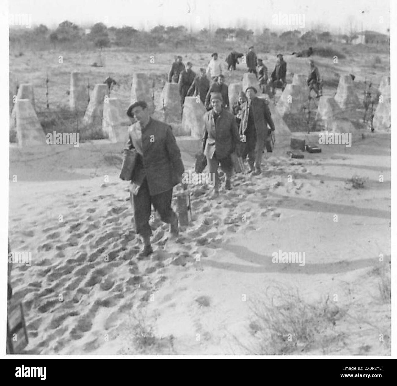 Pioneers carry box mines lifted from enemy minefields through anti-tank ...