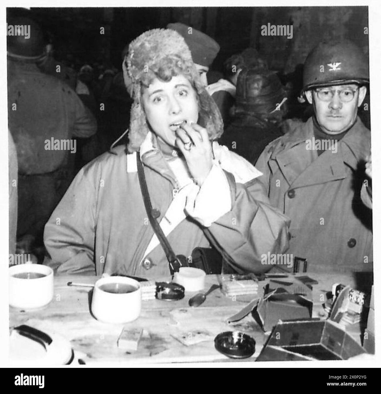 Mrs. Clare Booth Luce, visiting the Fifth Army front, eats lunch from K ...