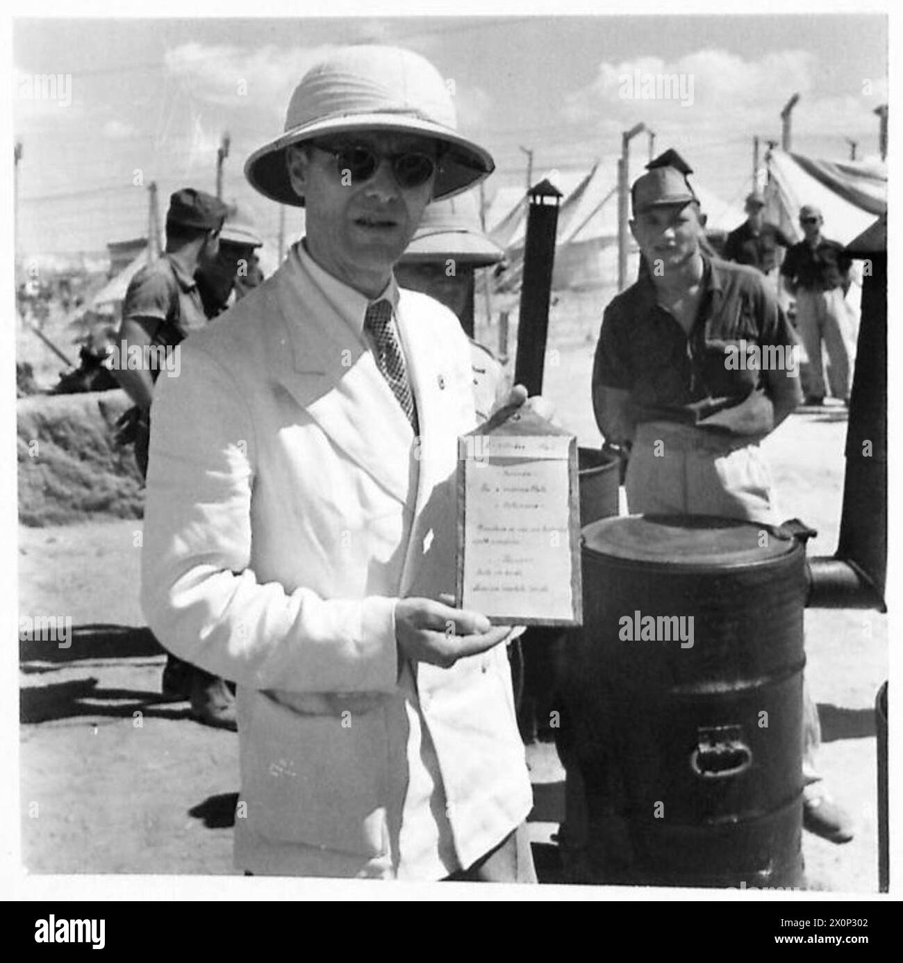 International Red Cross representative Mr. de Haller examines the daily ...