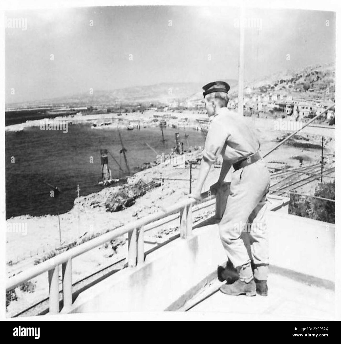 Ordinary Seaman R. Barrow of Blackheath is shown looking over the port ...