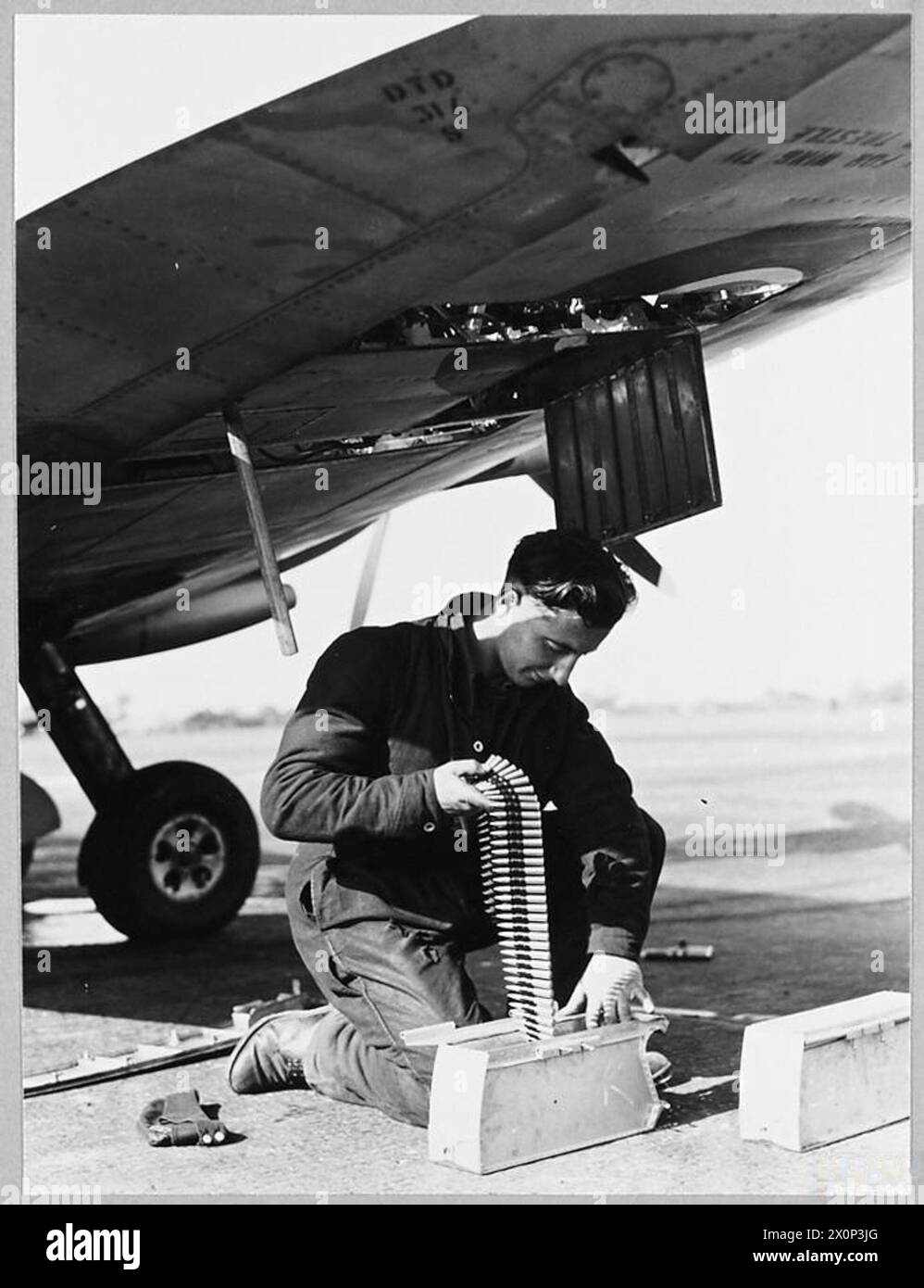 Leading Aircraftman E. Williams conducts a final ammunition check on a ...