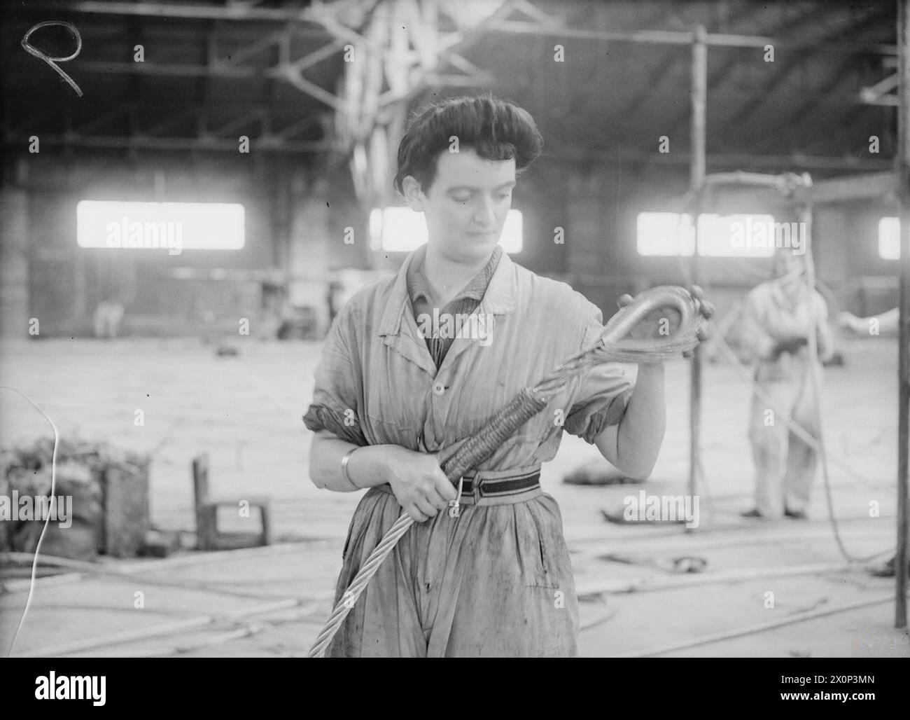A woman in Southampton completes an eye splice while making boom ...
