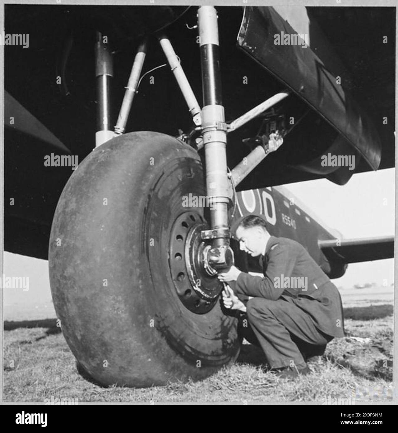 PREPARING AN R.A.F. LANCASTER BOMBER FOR A RAID - The weight of British ...
