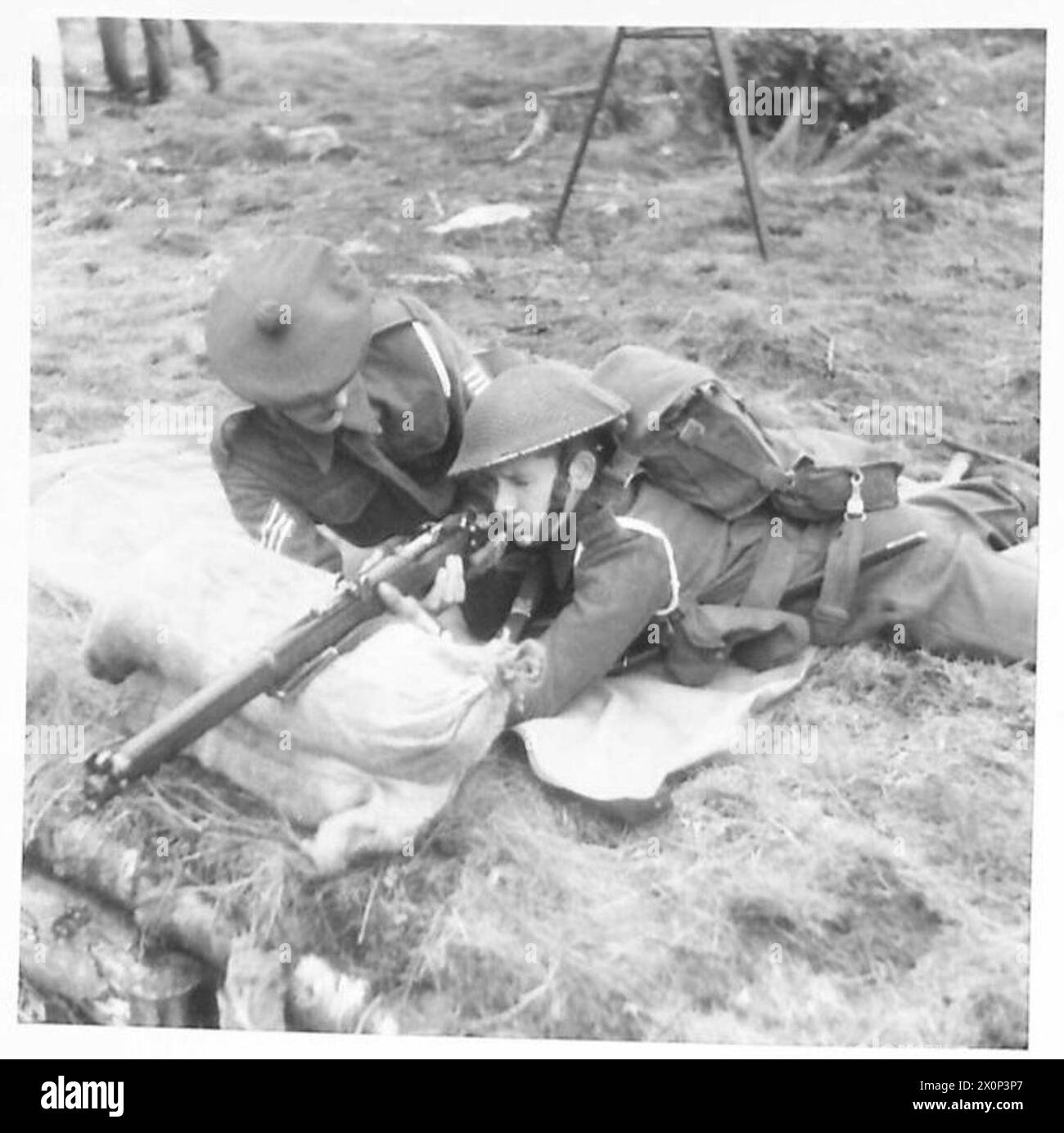 A new recruit is instructed on correct aiming techniques, documenting ...