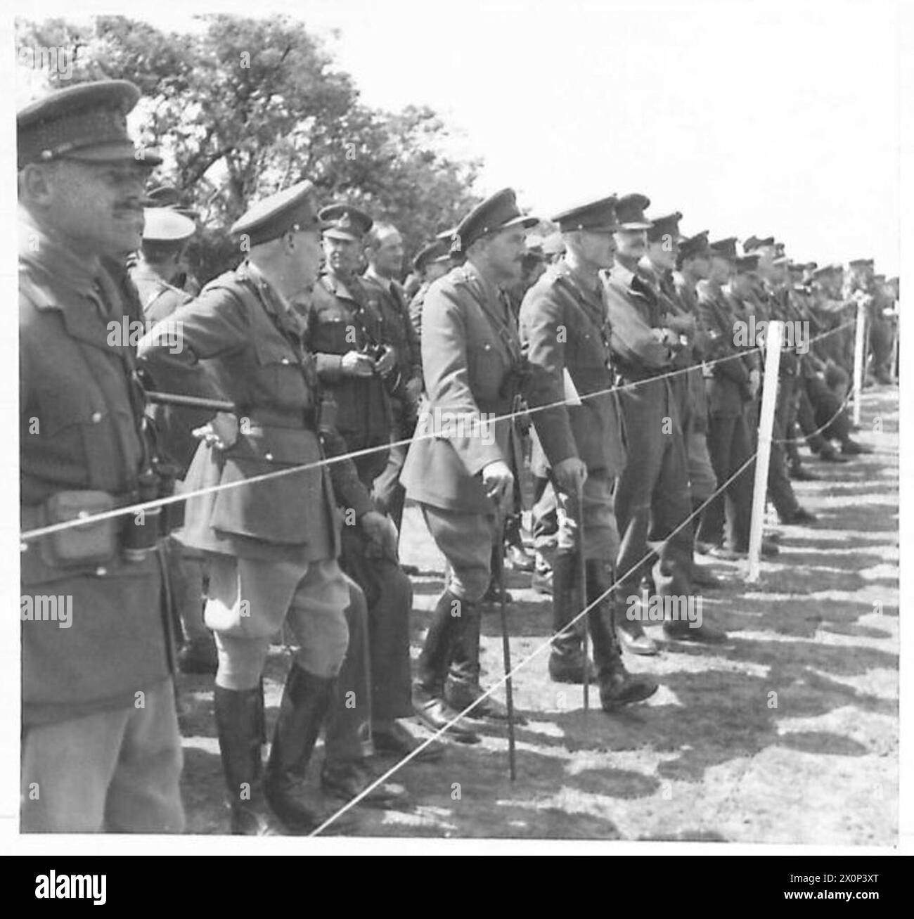 Photograph showing General Sir Alan Brooke and other officers observing ...