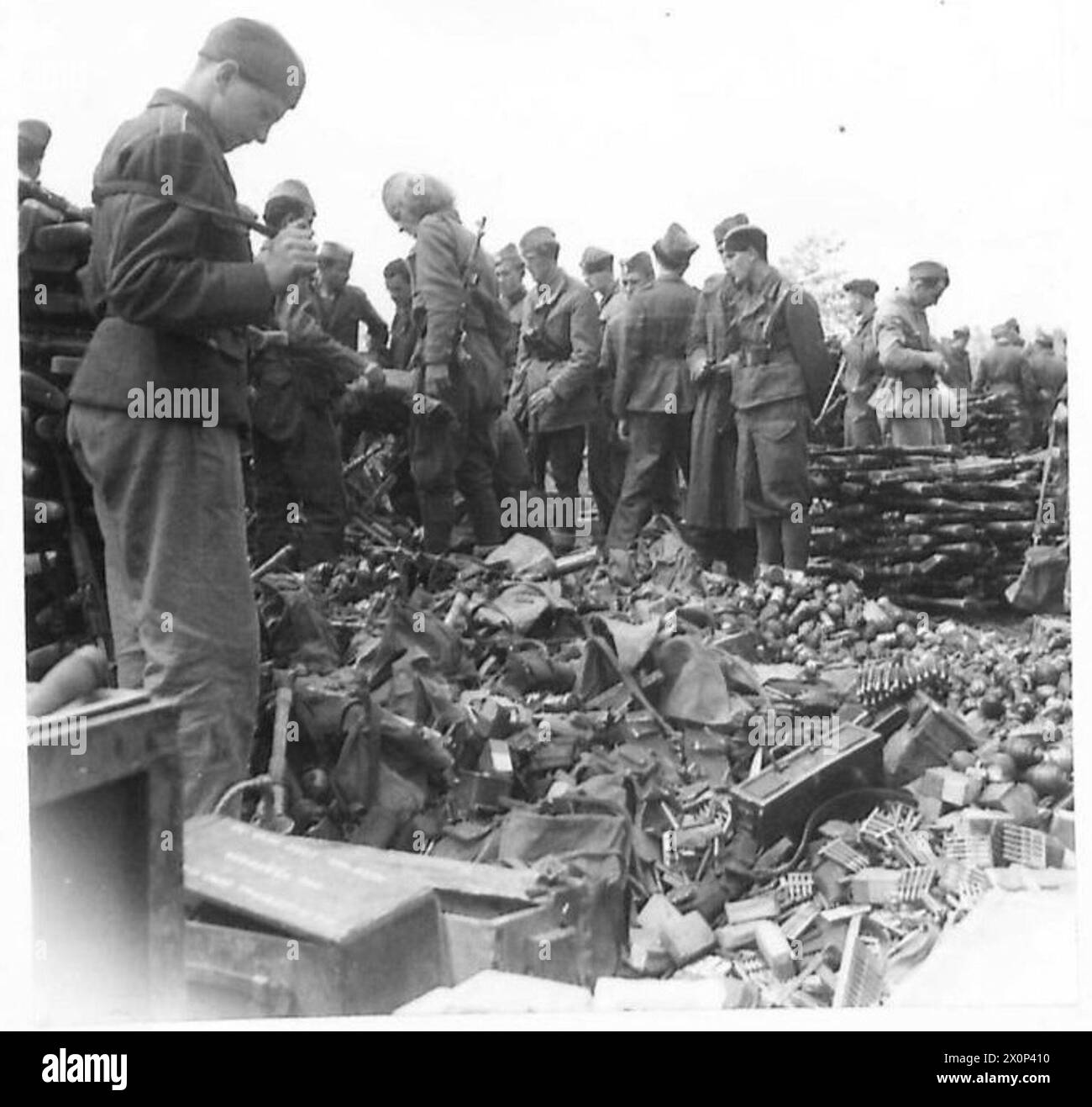 CHETNIKS HAND IN THEIR ARMS - The large piles of weapons and ammunition ...