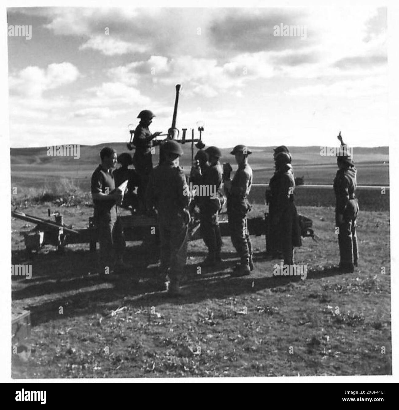 French troops observe gunners of the 280/49 Light Anti-Aircraft ...