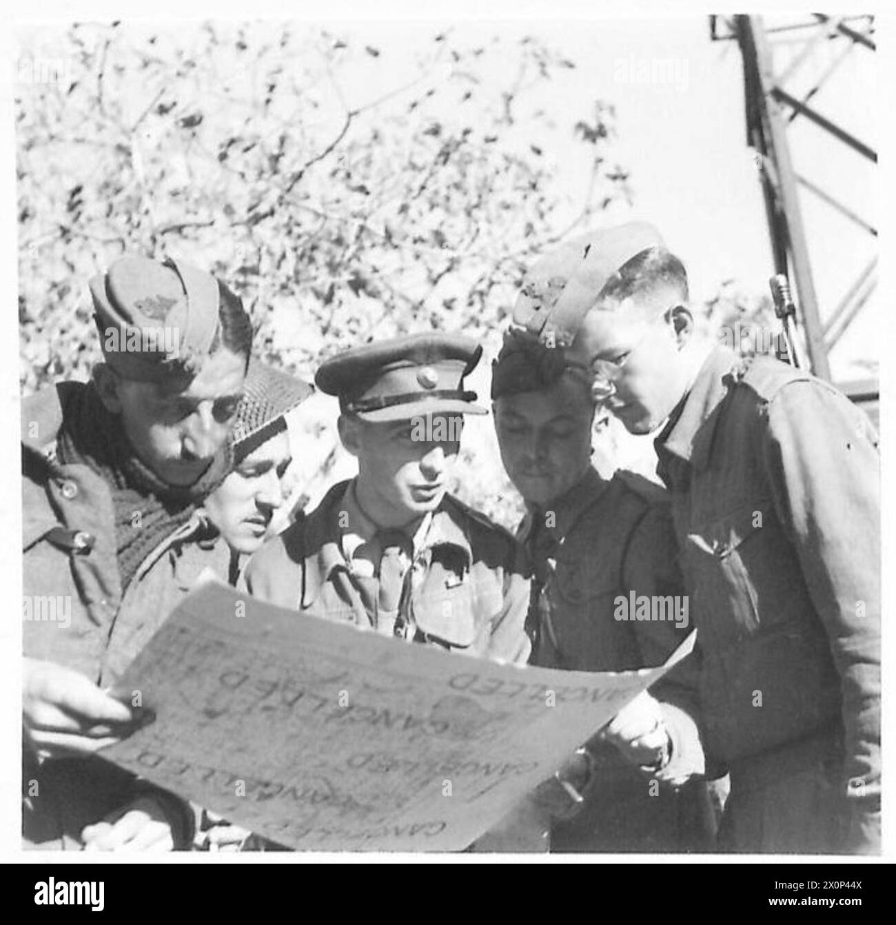 Lieutenant J.G.E. Pollock is pictured with Corporals Singleton and Gill ...
