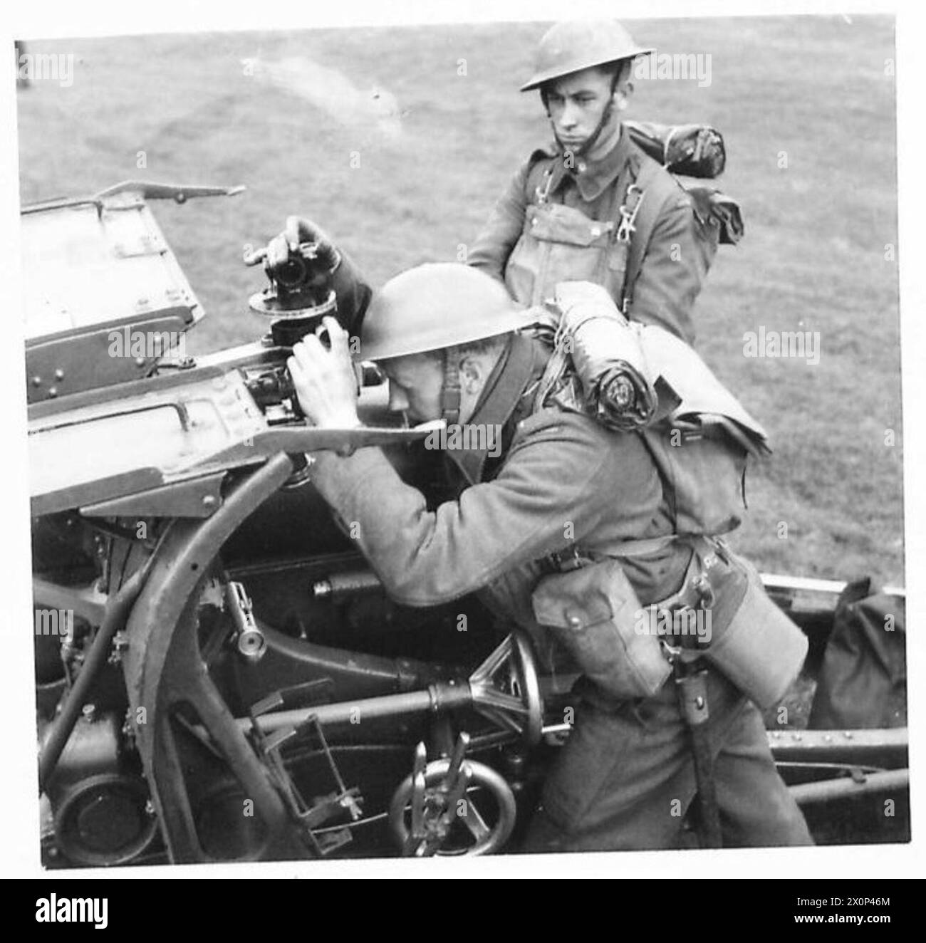 A gunner from the 1st Heavy Artillery Regiment, 1st Polish Corps, aims ...