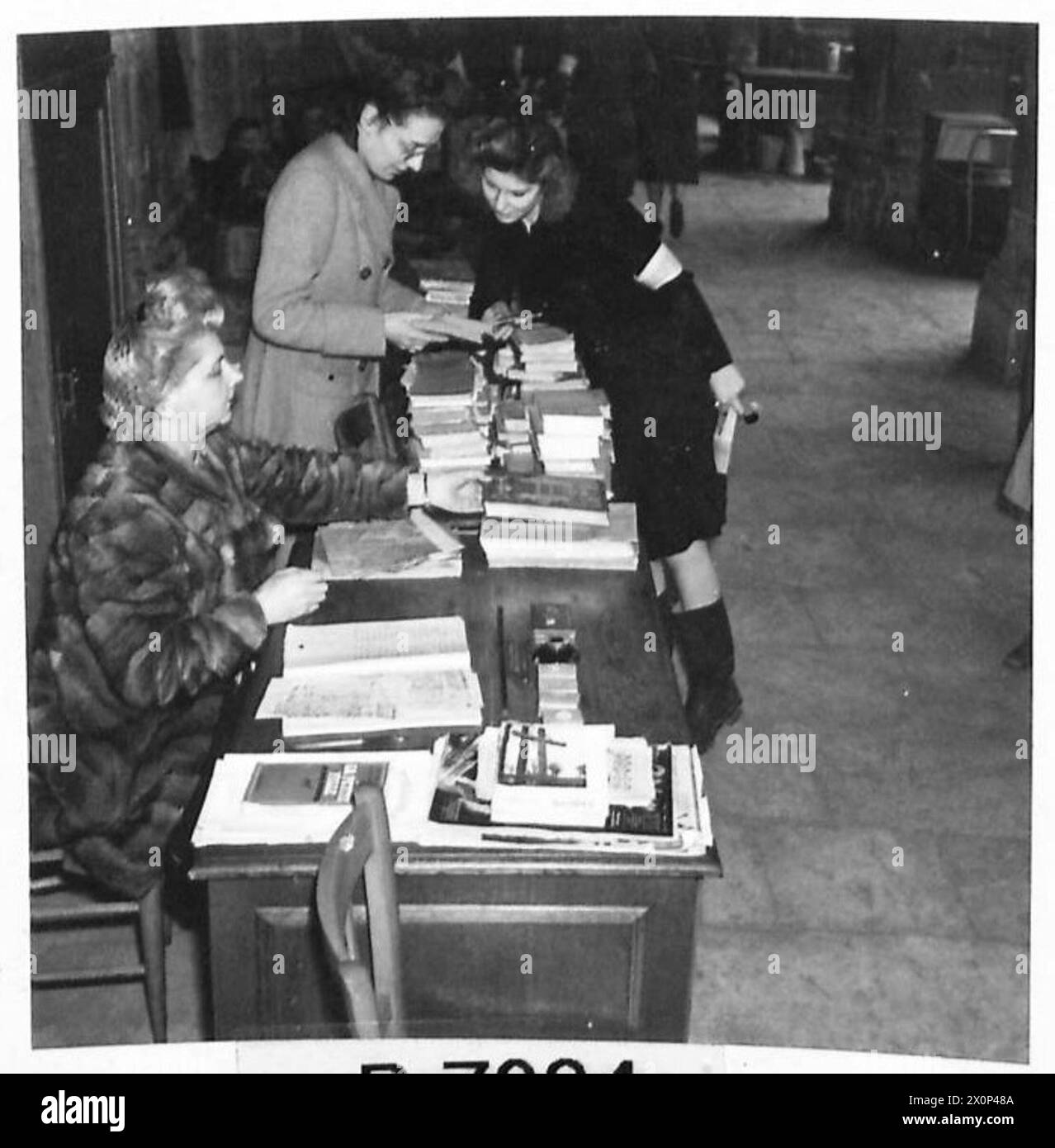 CAEN CATHEDRAL SHELTERS HOMELESS - Books saved from the bombed city ...