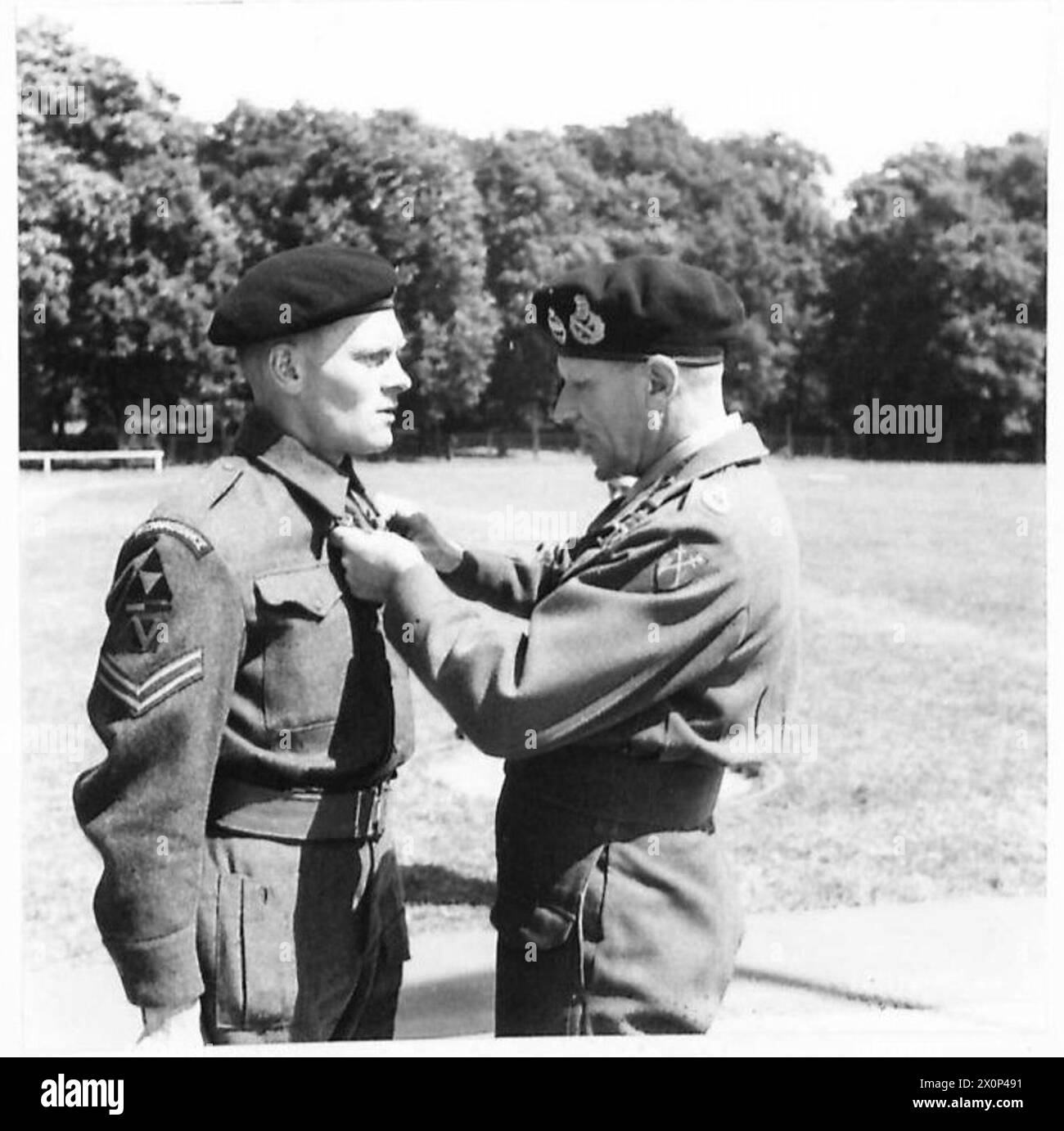 Corporal F. Armstrong of the 3rd Reconnaissance Regiment is awarded the ...