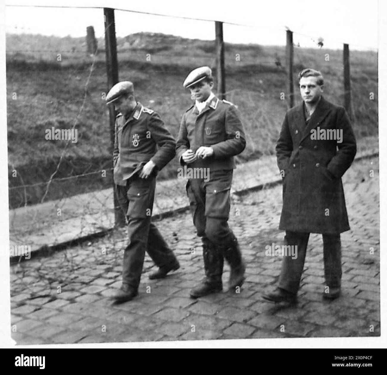 Various types of German prisoners are held in a prisoner-of-war camp ...