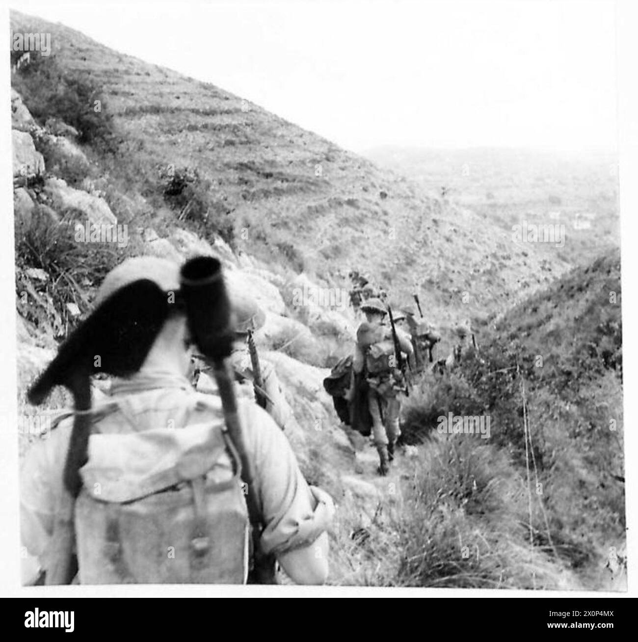 Soldiers of the 10th Royal Berkshire Regiment descend a hillside after ...