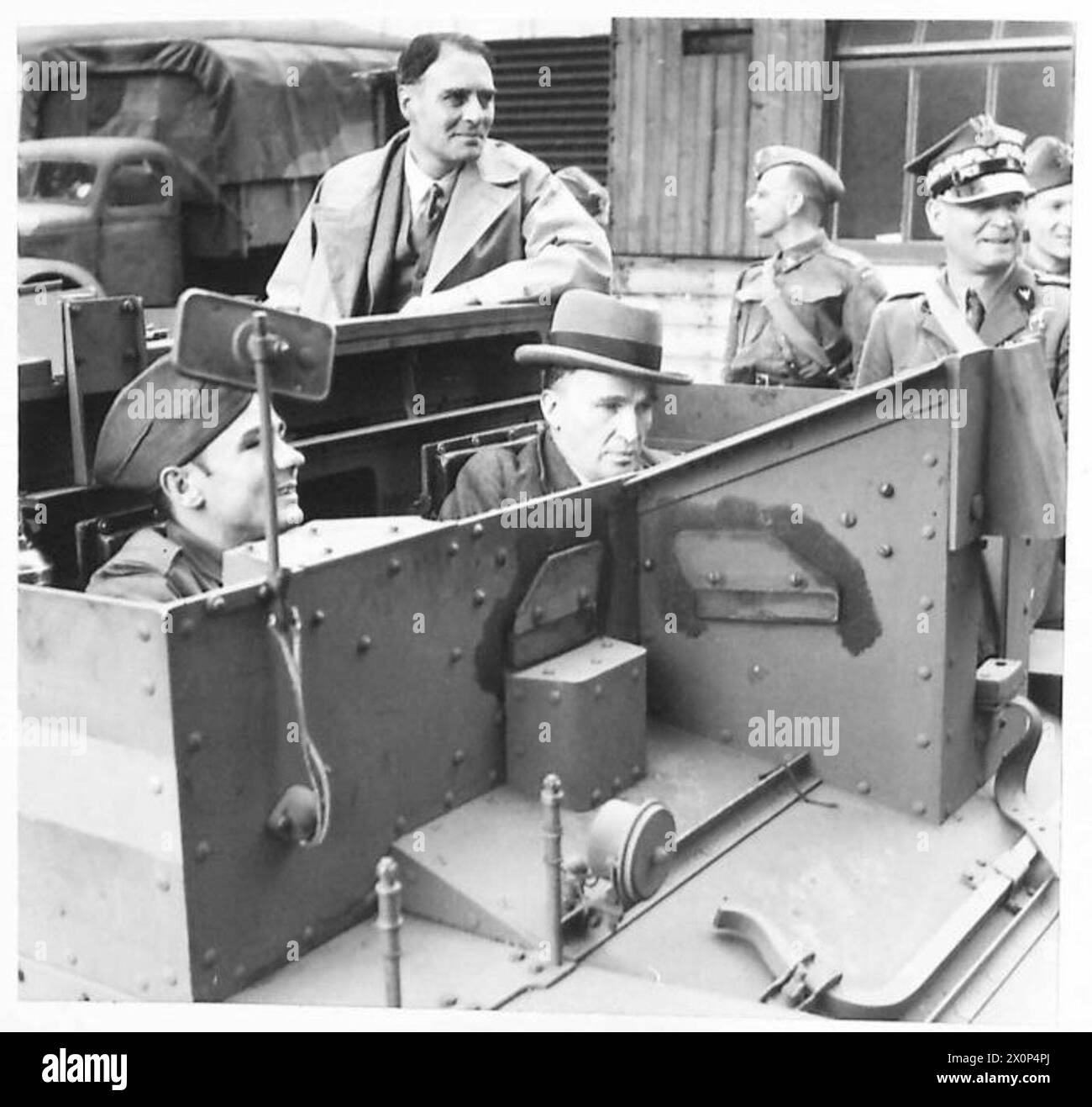 Judge William M. Clark and British Vice Consul E. J. Bisiker in a Bren ...