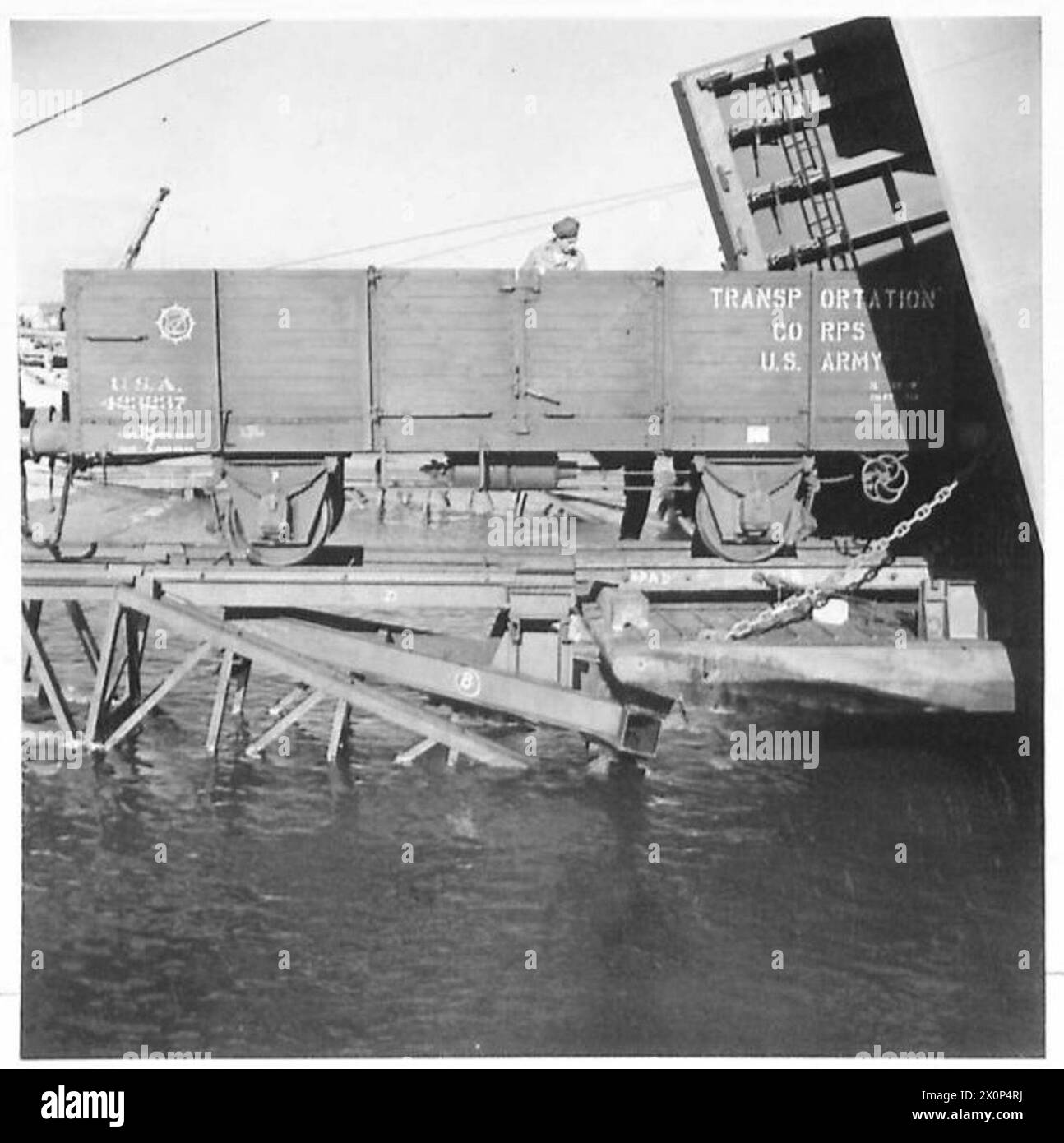 PHOTOGRAPHS OF PREFABRICATED PORT, ETC. - Wagon passing ashore from L.S ...
