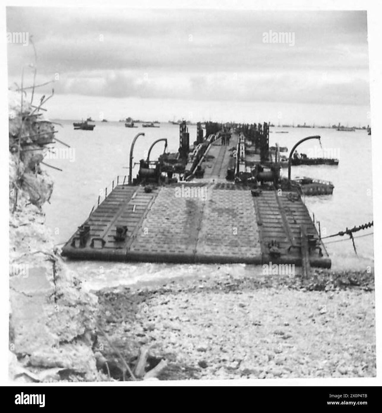 Photograph showing a prefabricated shore ramp float beached, used for ...