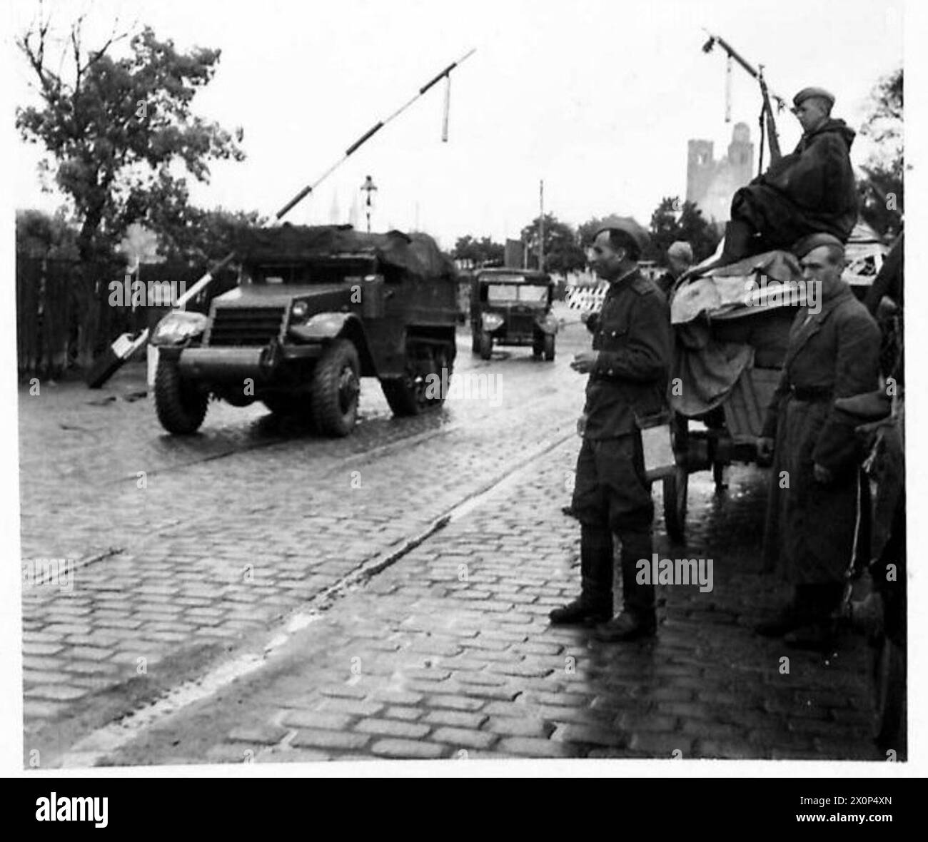 Advance troops of the British 7th Armoured Division pass a Russian ...