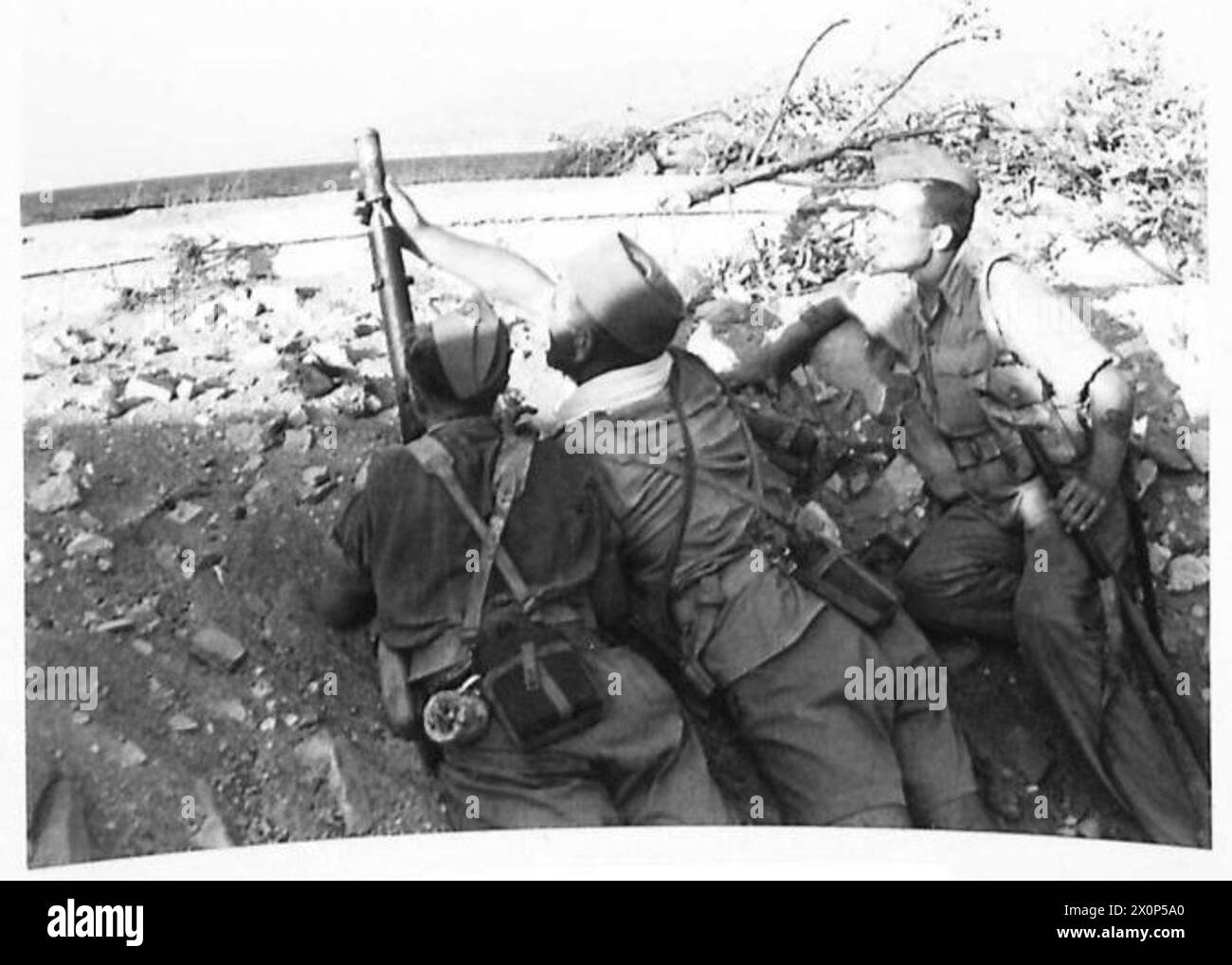 8TH ARMY ENTERS MESSINA - 2" Mortar position of the East Yorks Regiment ...