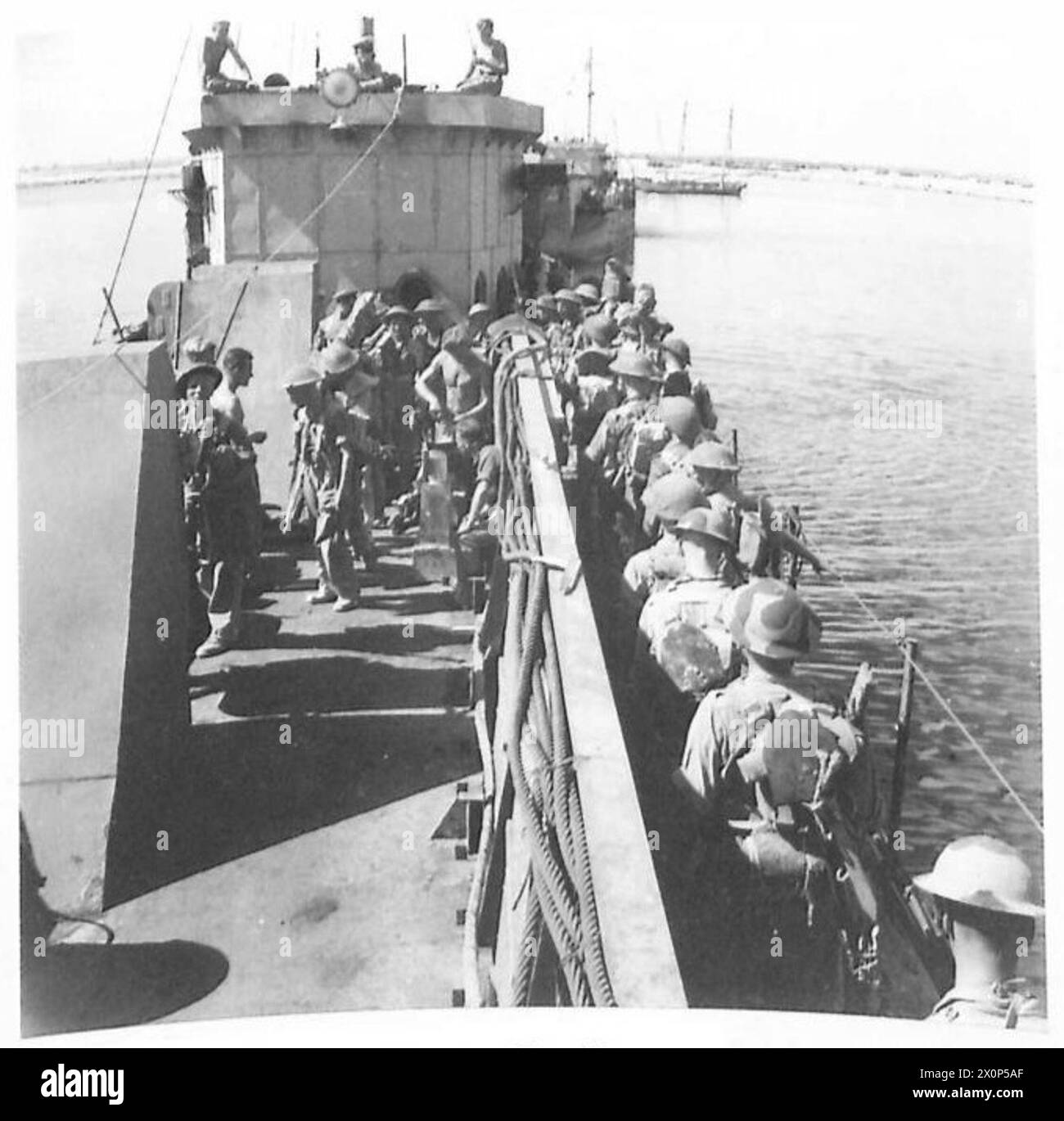 Troops are shown boarding an L.C.I. at Tripoli during British Army ...