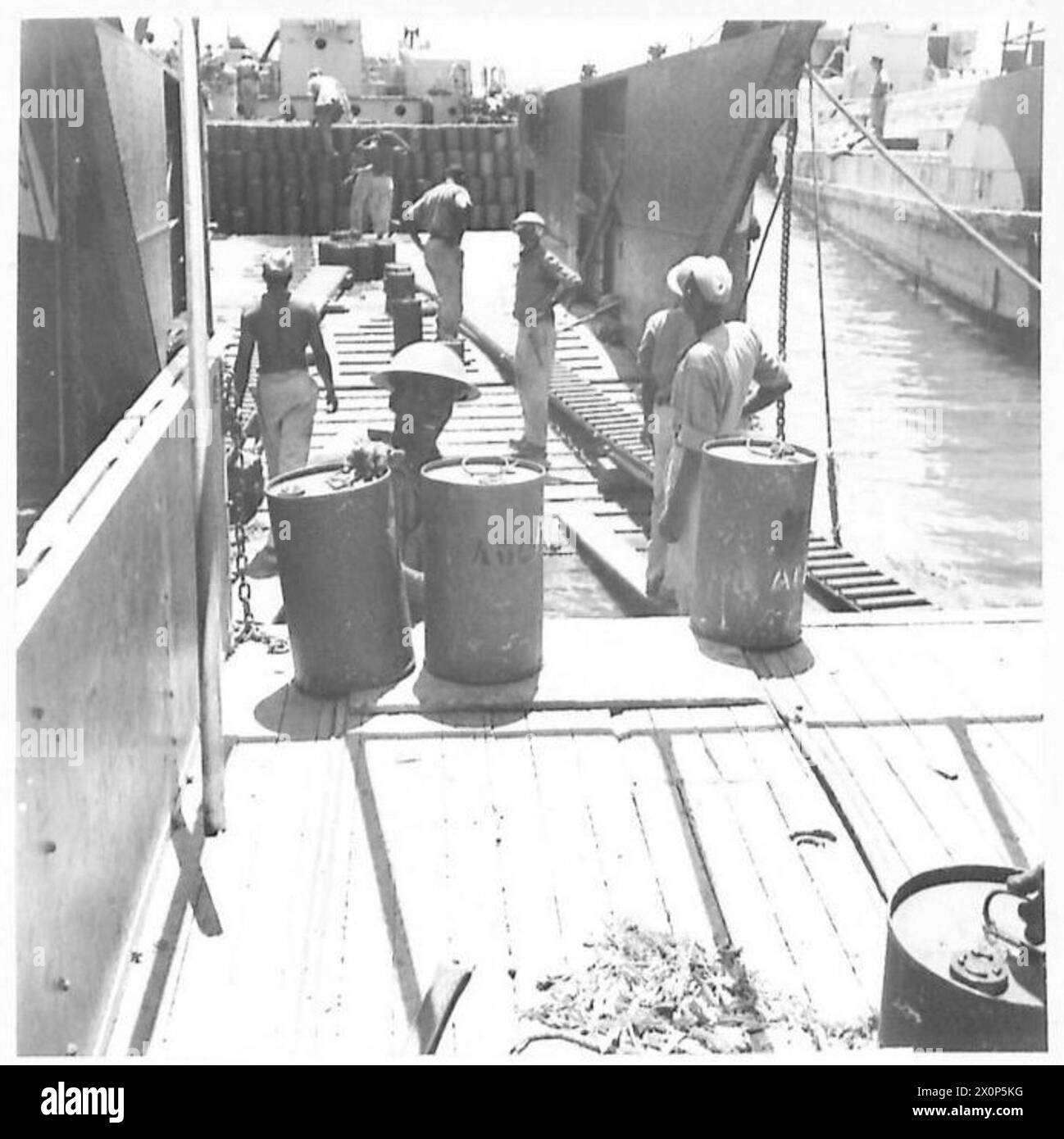 THE CAPTURED BASE OF AUGUSTA - Pioneers loading oil into trucks ...