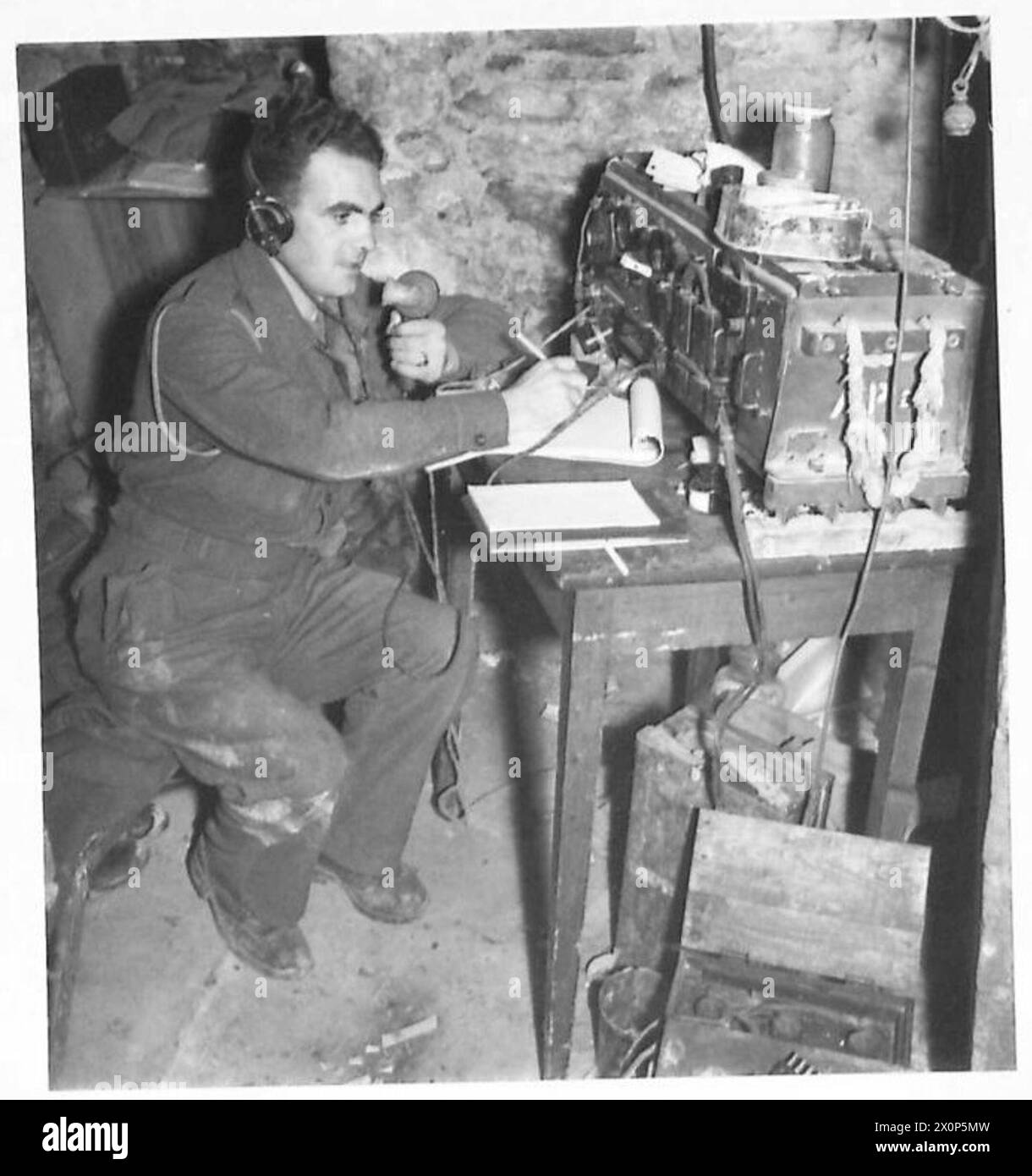 Lance Bombardier F.W. Howarth operates a wireless set at the Listening ...