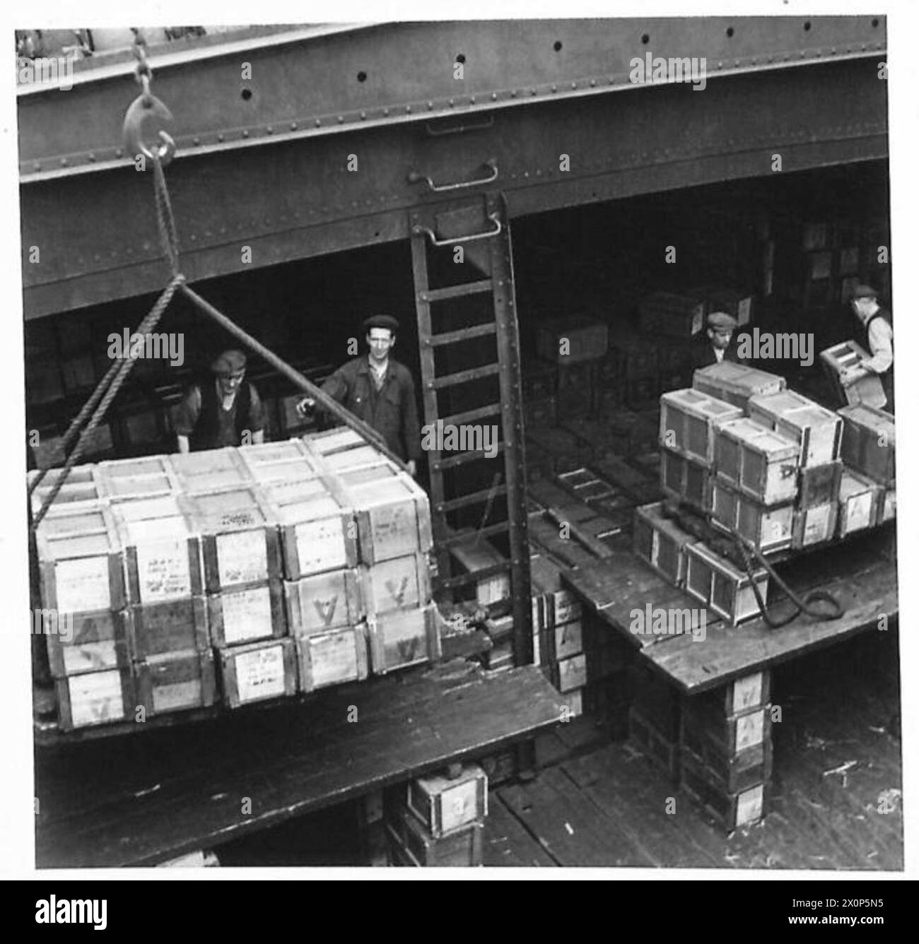 LOADING COMPO PACKS INTO SHIPS - Compo packs being loaded into a ship ...