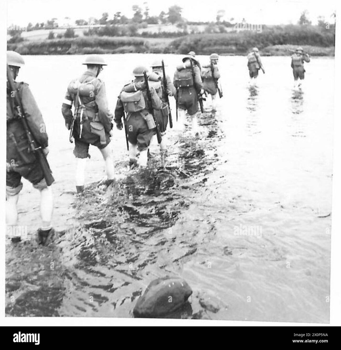 Troops ford a river in Northern Ireland during a military exercise ...