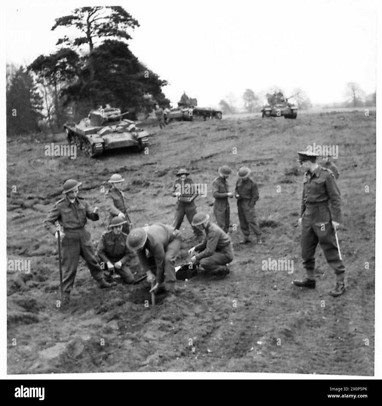 Sappers place explosive charges to simulate an enemy minefield during ...