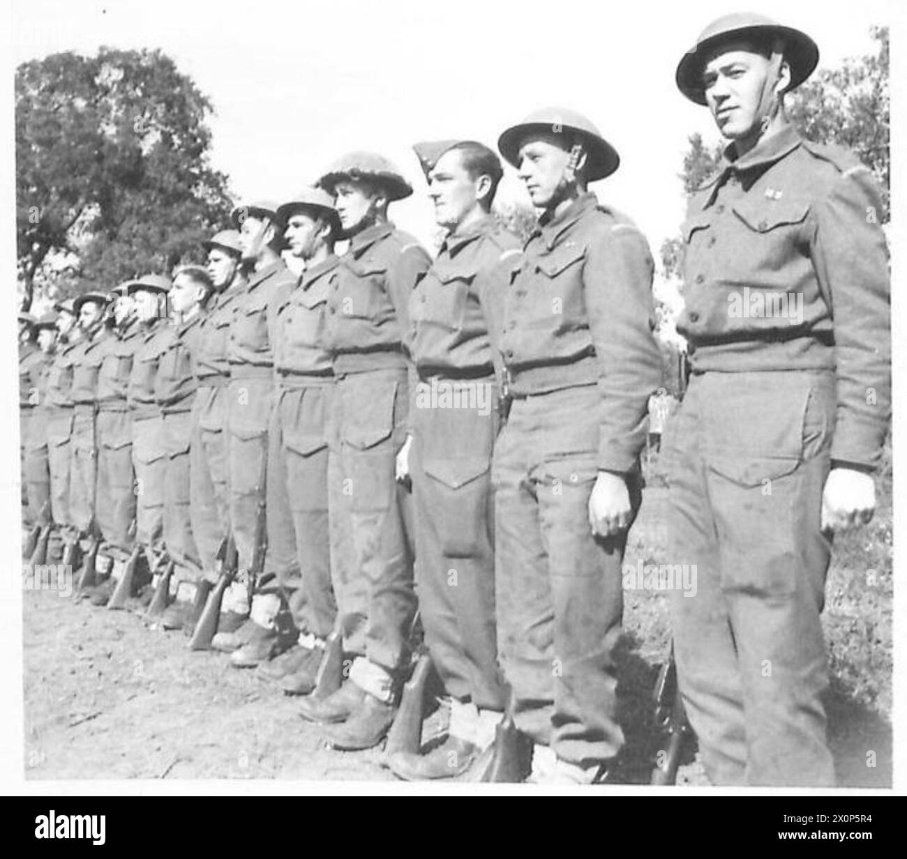 Troops of the Wellington Regiment of the British Fifth Army are shown ...