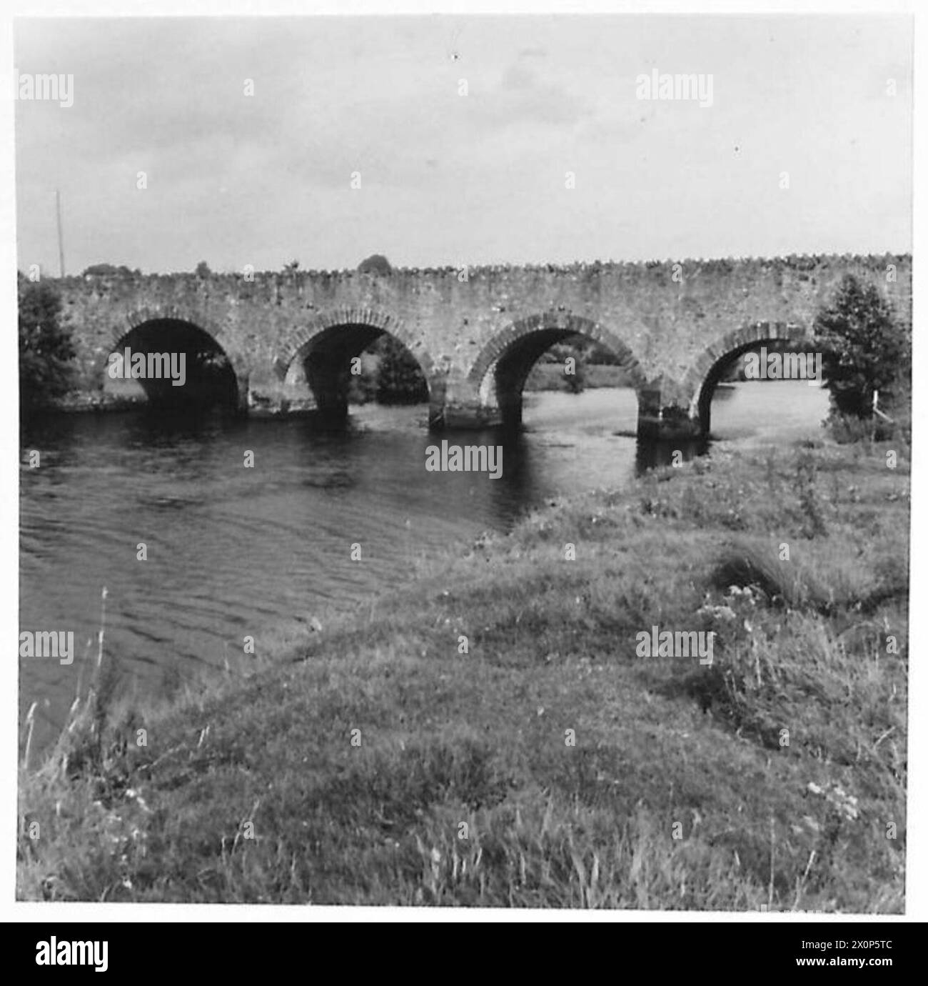 Tullymore Bridge is documented in a photographic negative. The image ...