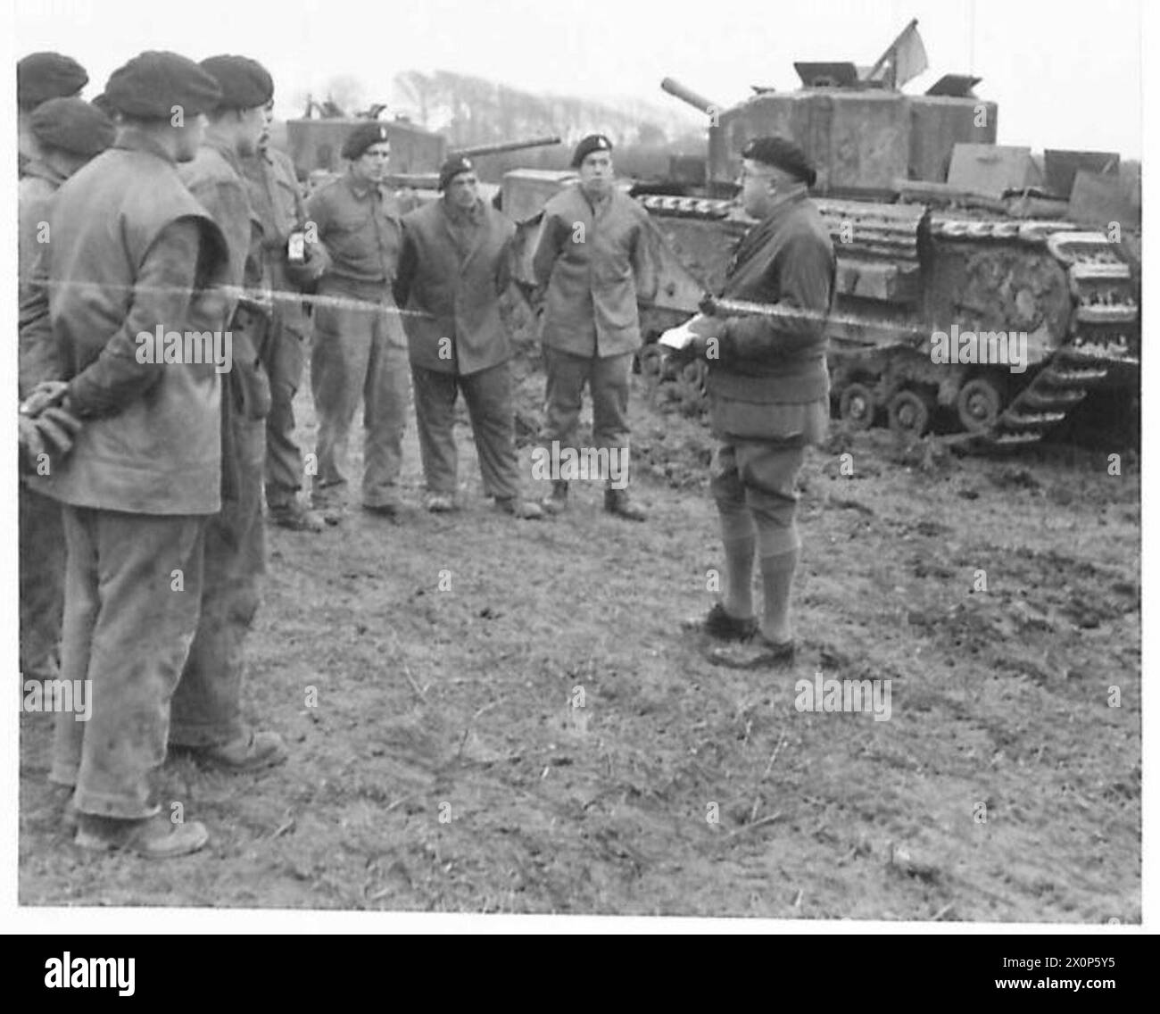 TANK CREWS IN TRAINING - Tank crew personnel listen to a lecture given ...
