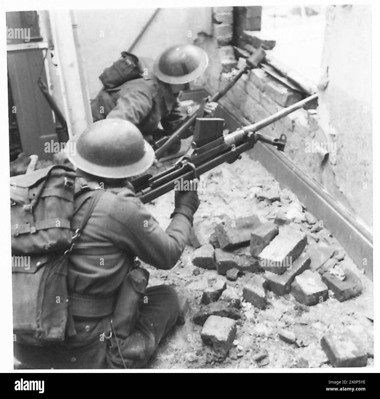 BOMBED STREETS PROVIDE ARMY WITH PRACTICE BATTLEGROUND - Soldier with ...