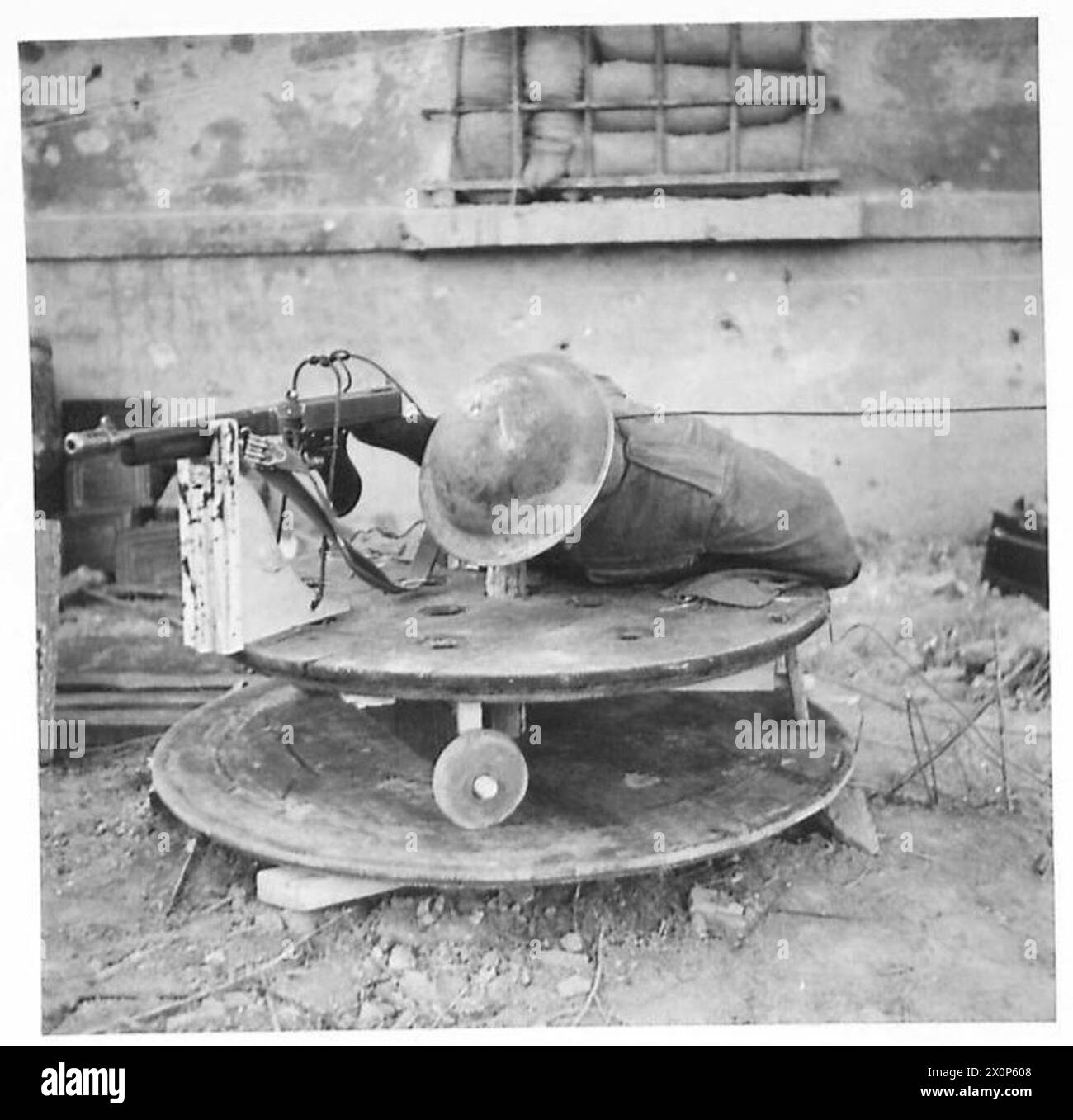 A decoy dummy soldier, 'George' or 'Polish V3', falls flat as if shot ...