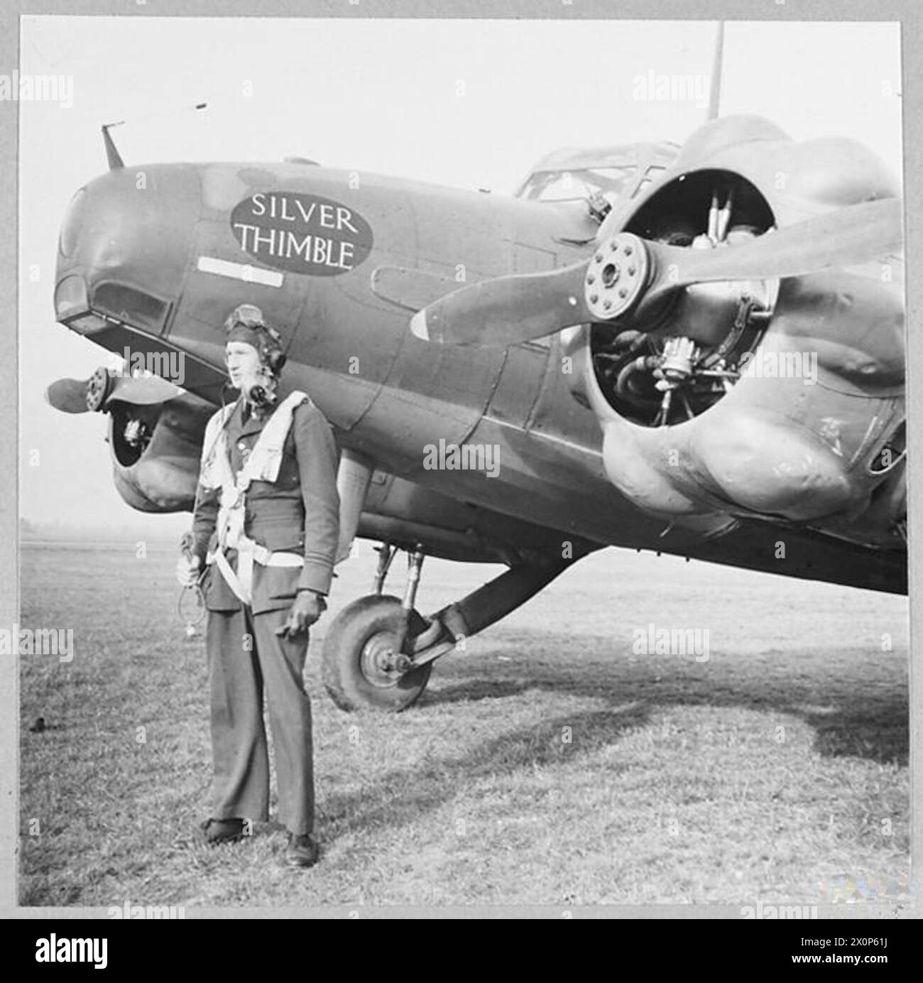 Flight Lieutenant J. Alexander is shown beside the Anson ambulance ...