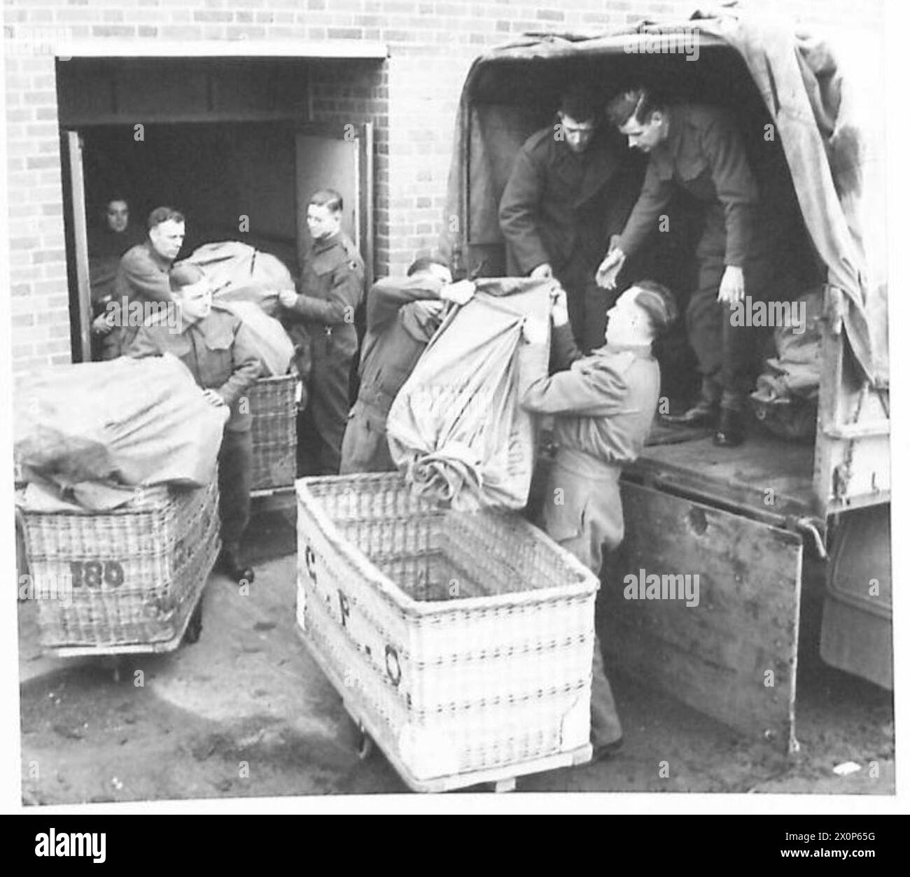 Personnel of the Army Postal Service are loading mail bags into Army ...