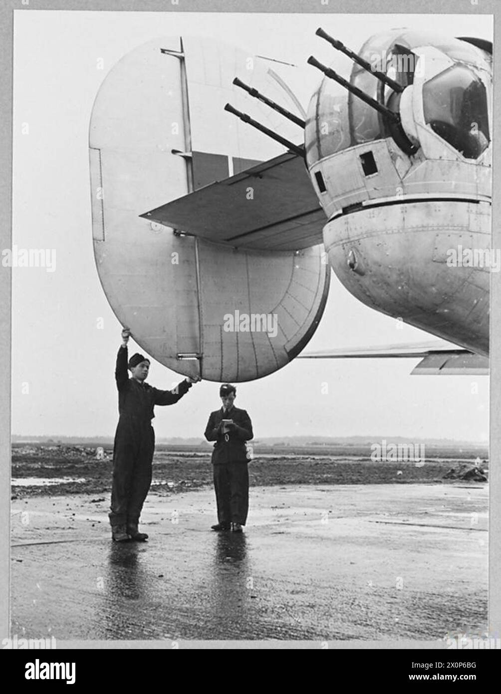 A sergeant fitter inspects the rudder hinges of a Coastal Command ...