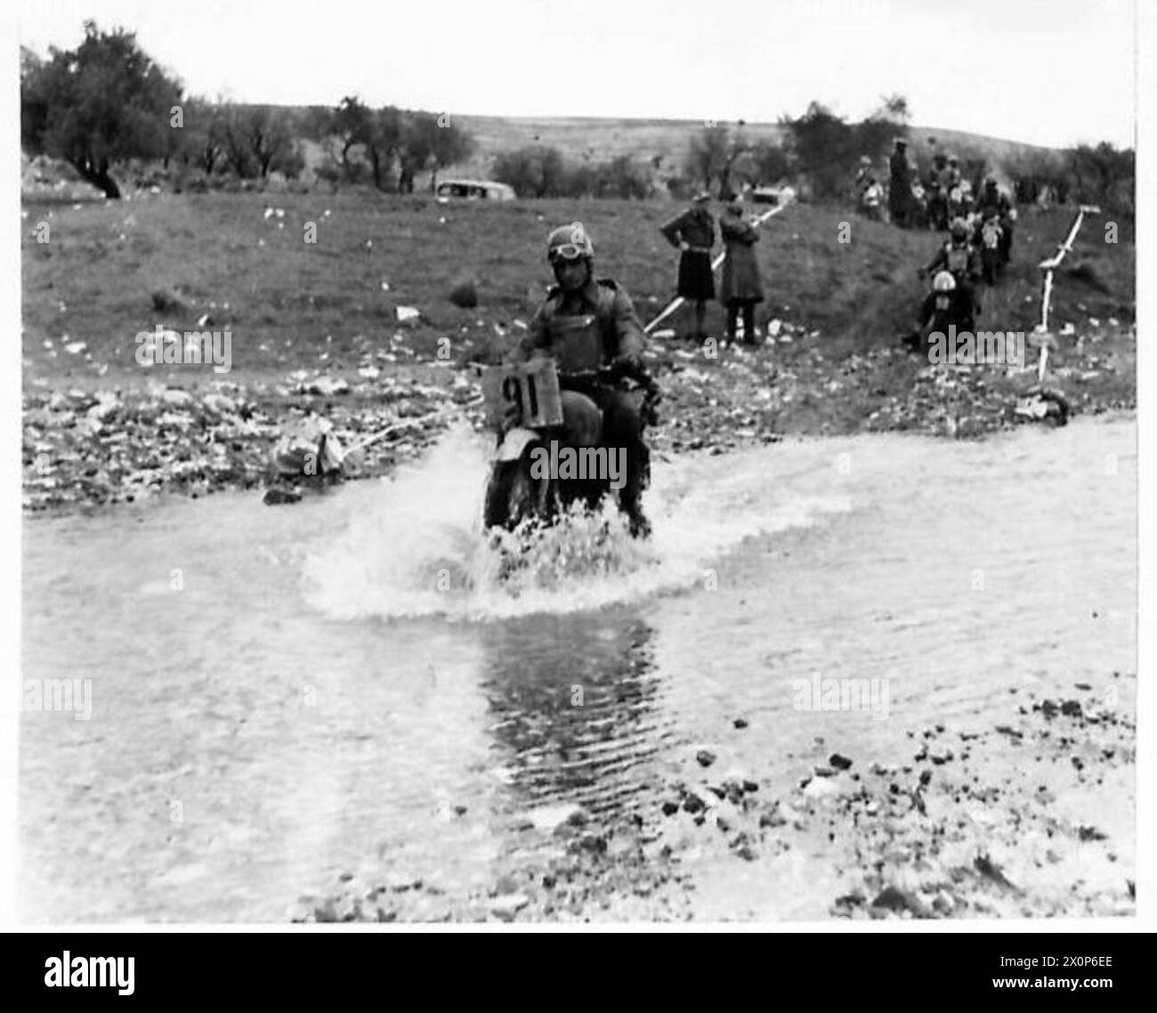 Dispatch riders negotiate obstacles including water splashes during a ...
