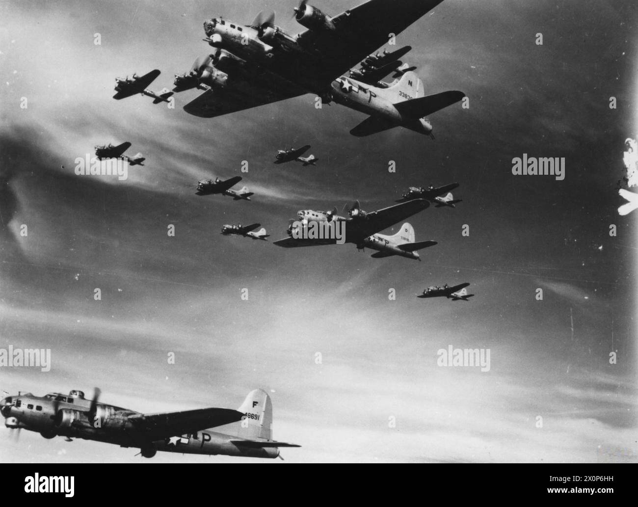 B-17 Flying Fortresses of the 493rd Bomb Group fly in formation over ...