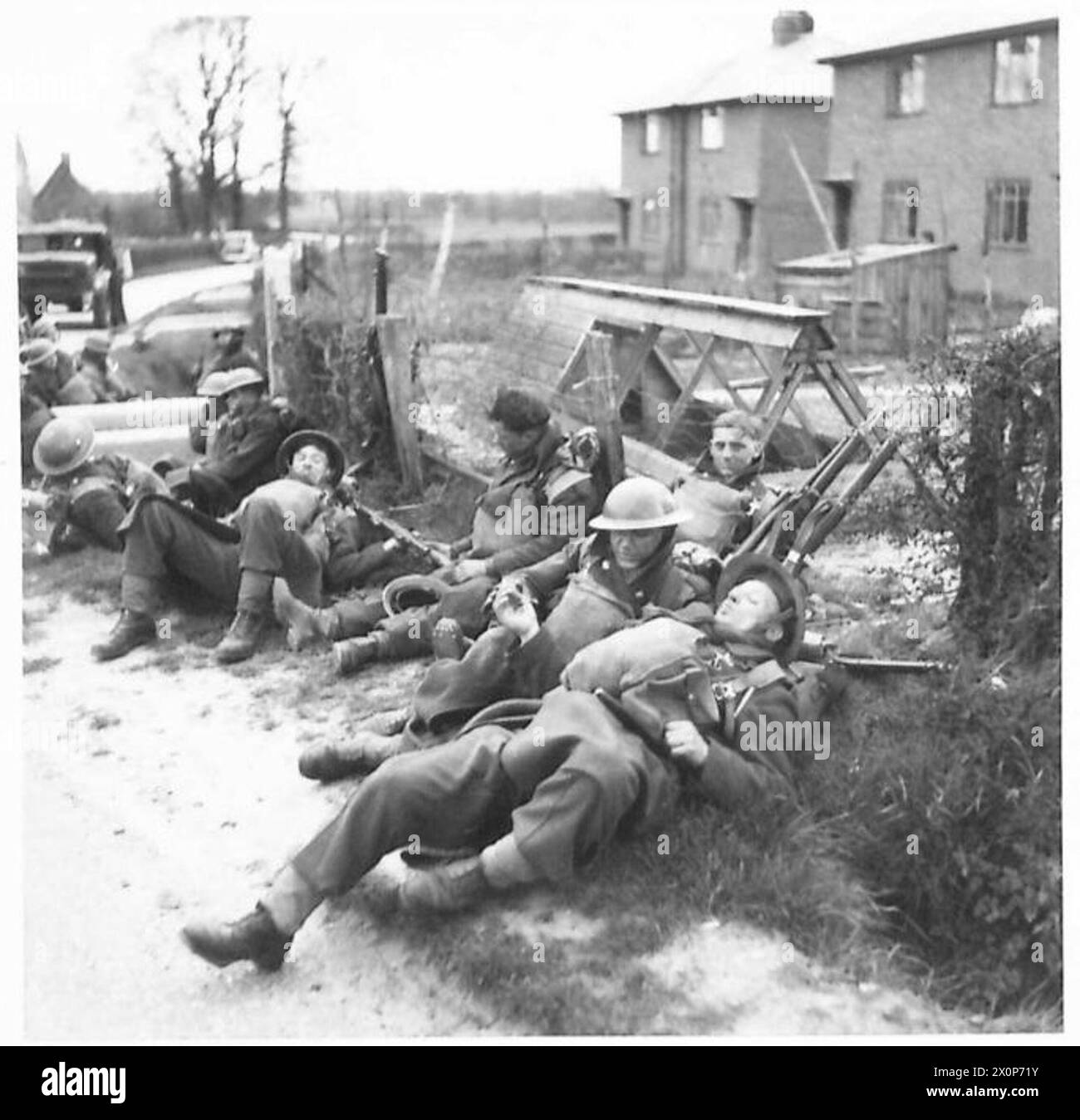 Troops taking a brief rest during large-scale invasion exercises, after ...
