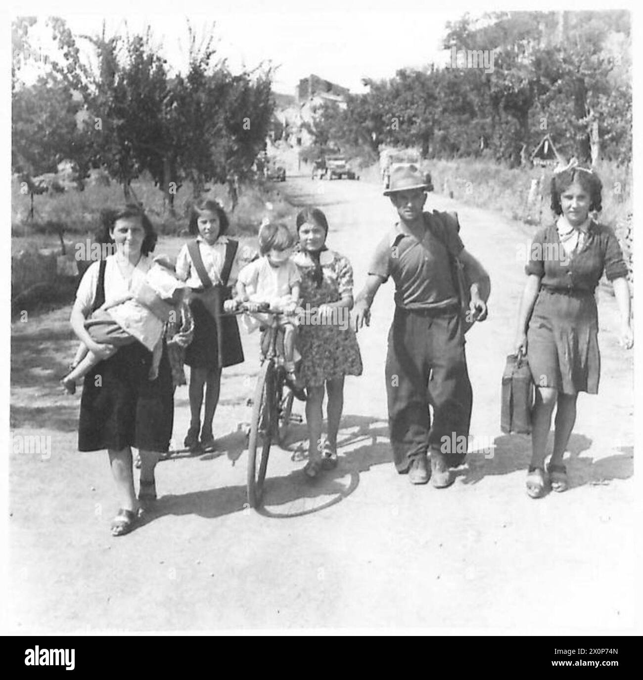 EIGHTH ARMY : VARIOUS - An Italian refugee carrying her injured child ...