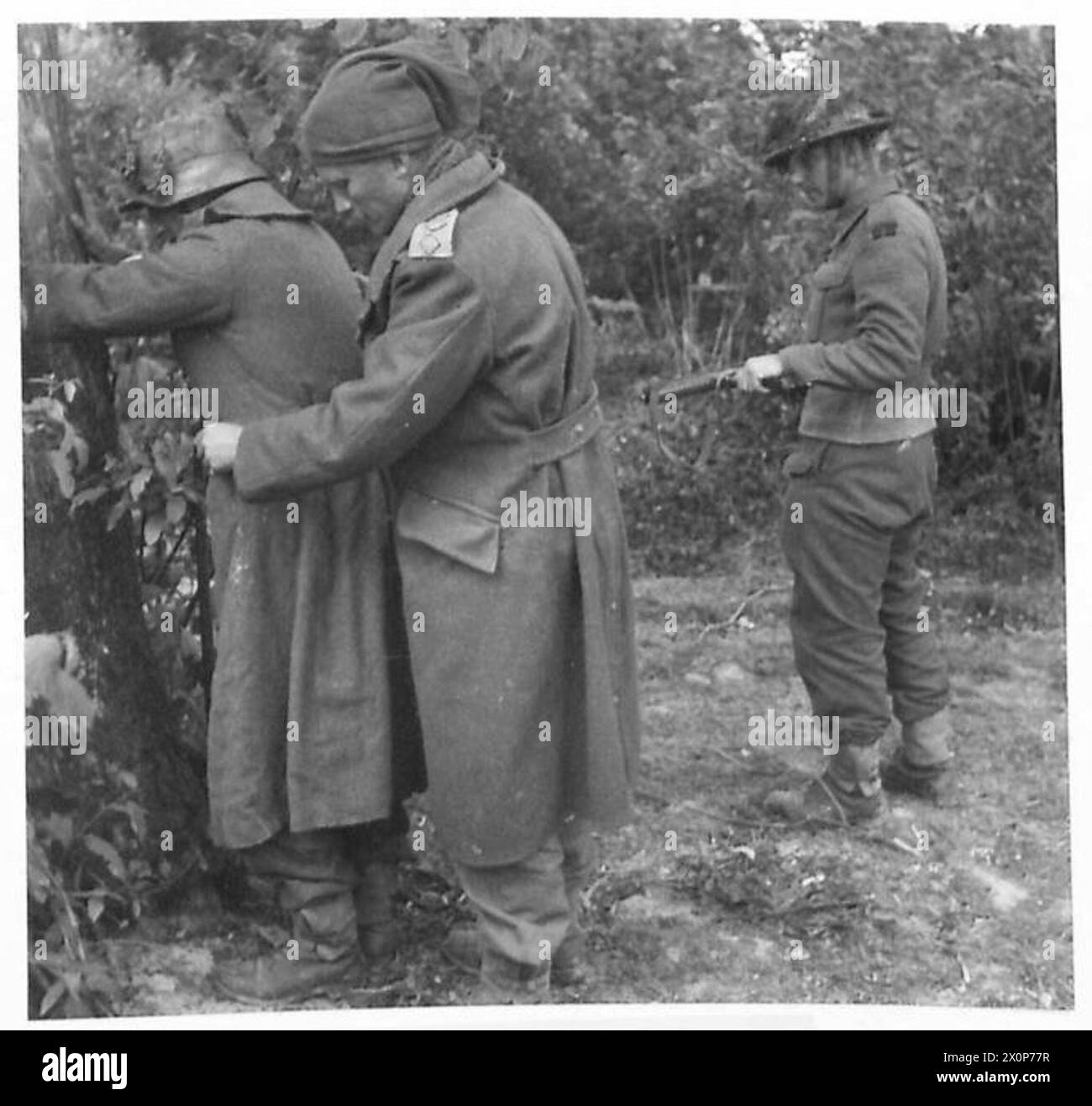 NORMANDY - VARIOUS - A German prisoner brought in by one of the patrols ...